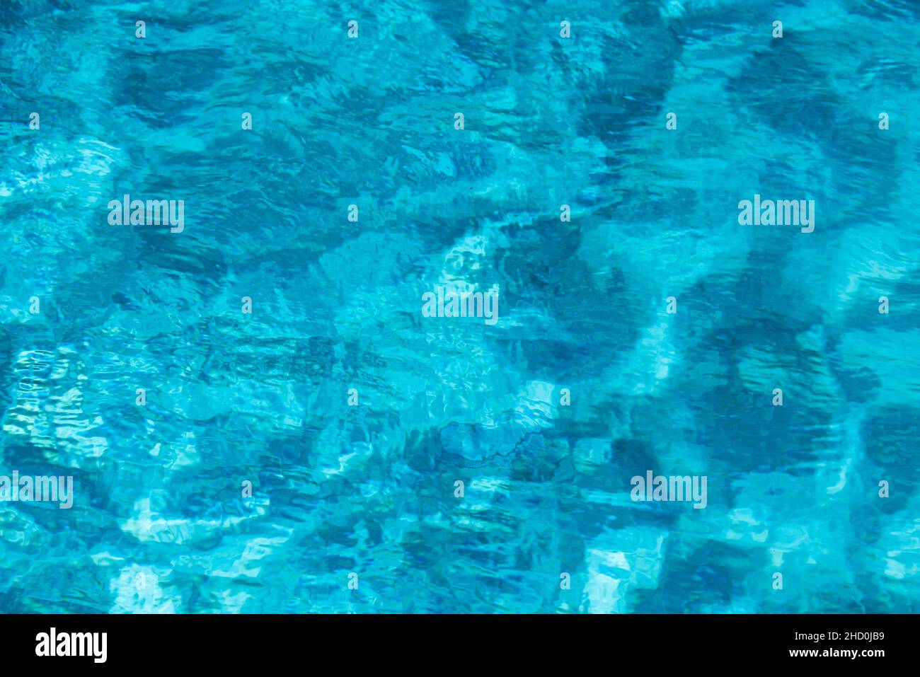 Abstract ripple wave and clear turquoise water surface in swimming pool ...