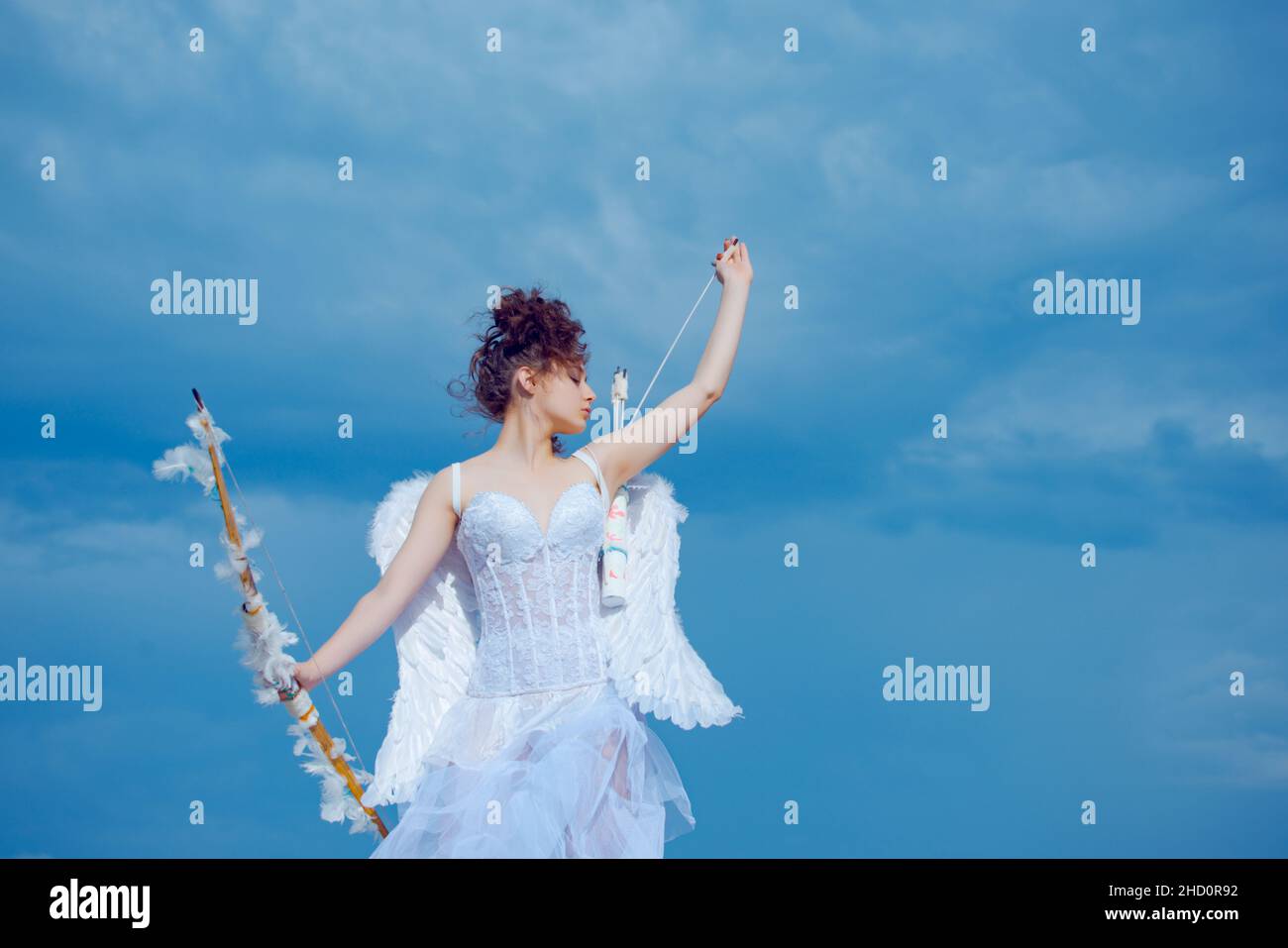 Girl aiming arrow sky hi-res stock photography and images - Alamy