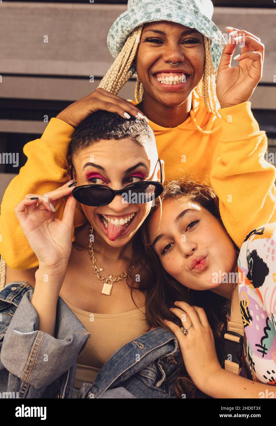 Female friends having fun together outdoors. Group of generation z ...