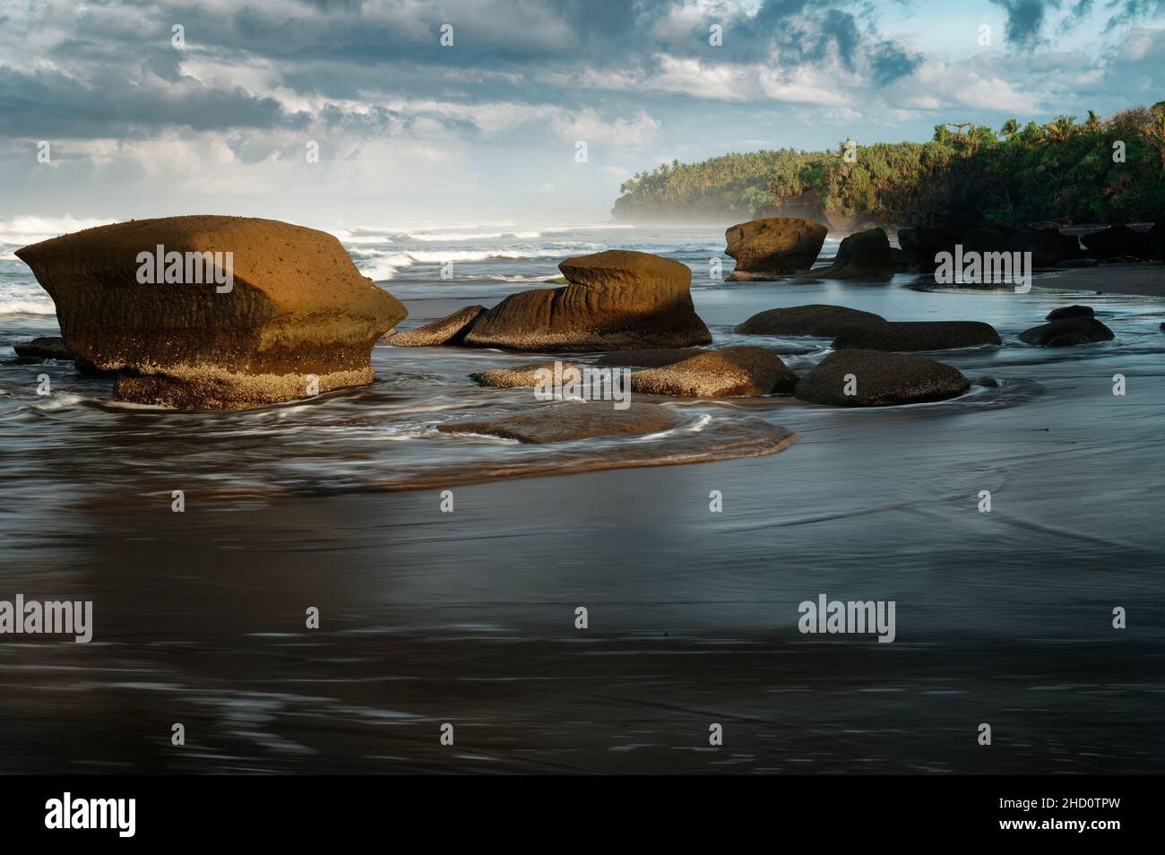 Spectacular sun beam illuminating the beautiful ocher rocks , giving a ...