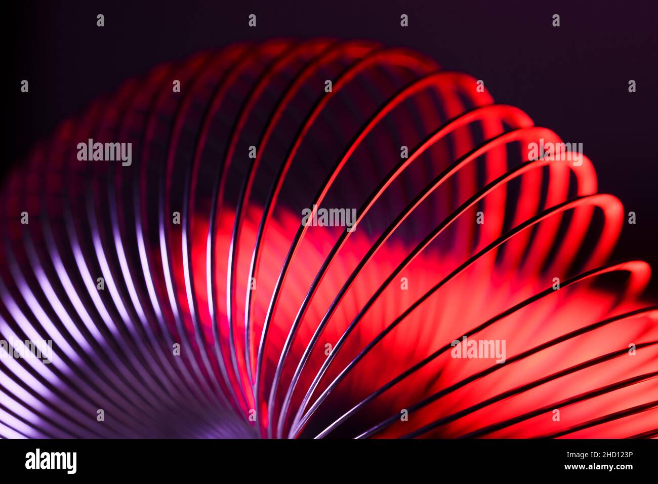 Closeup of coiled metal spring with sufficiently high strength and ...