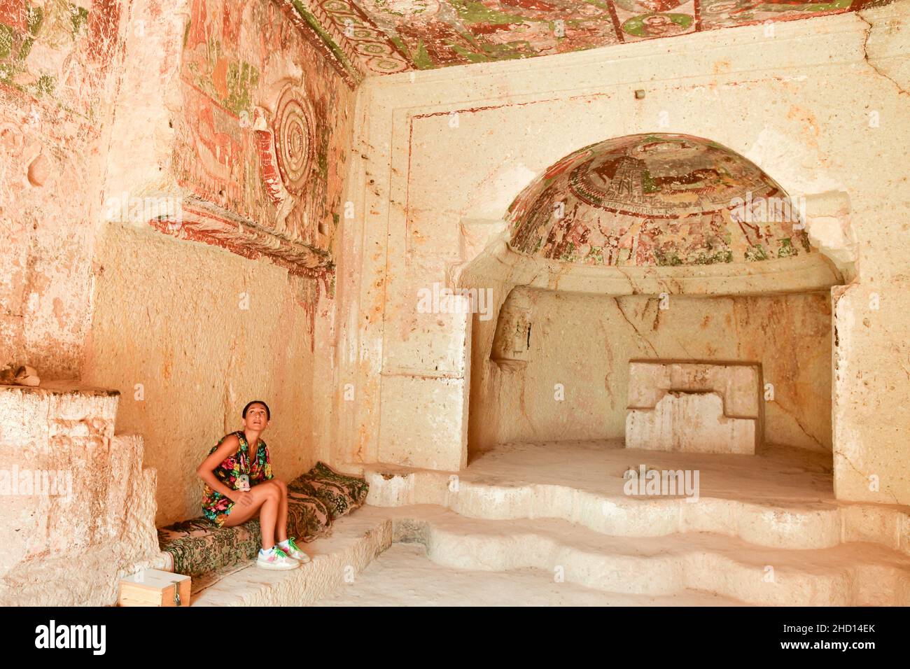 female tourist in Pancarlik kilise church limestone cave building ...