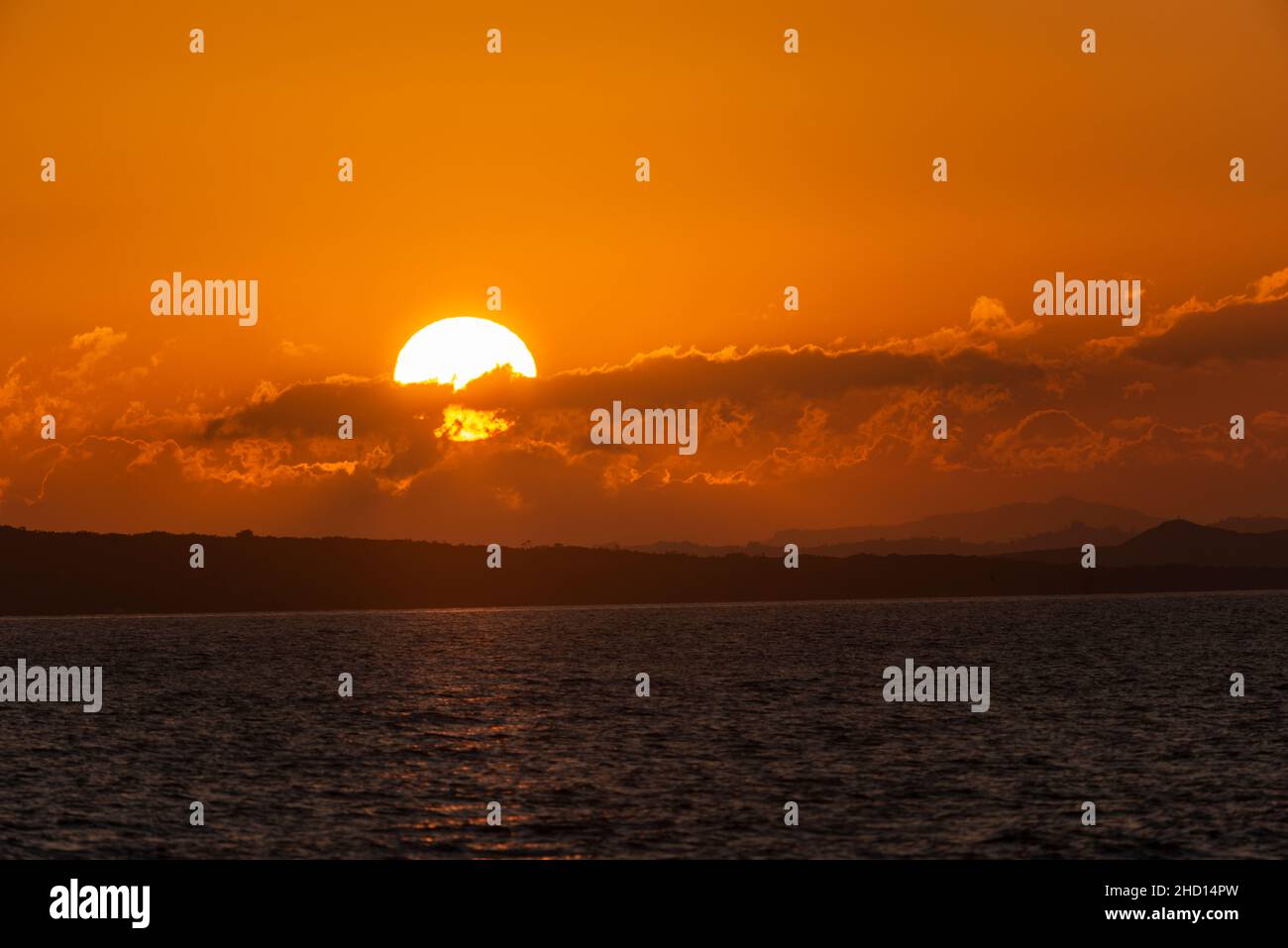 Sun rising above clouds hi-res stock photography and images - Alamy