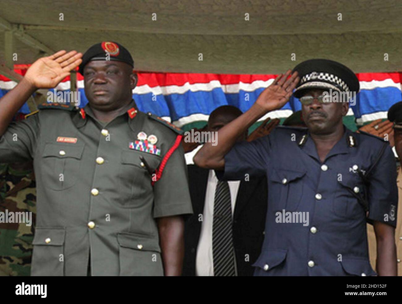 Robert S. Ferrell and Gambian officers saluting (cropped Stock Photo ...