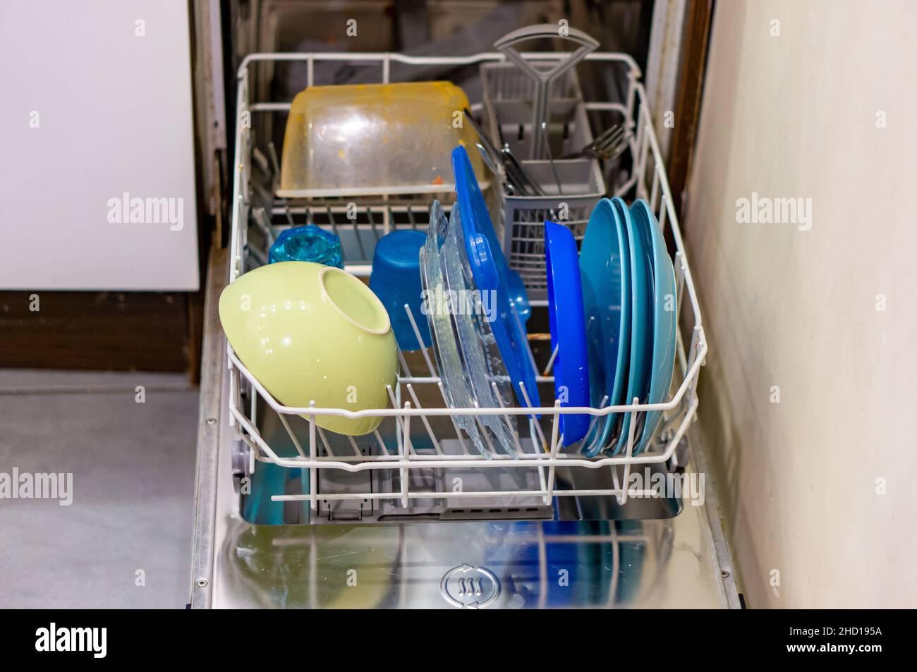 Closeup shot of dirty plates in the dishwasher Stock Photo - Alamy