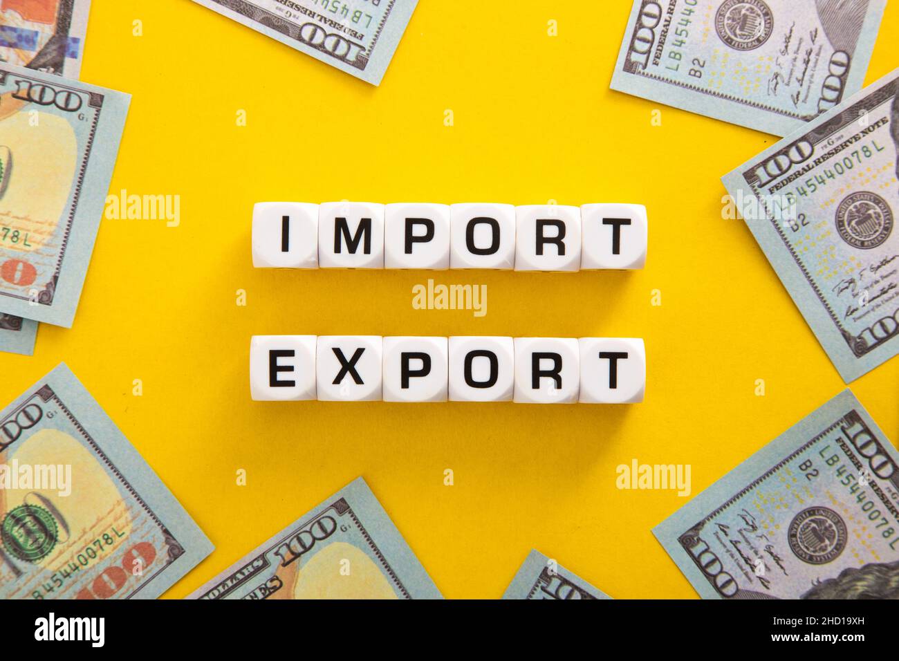 Import and export word on yellow background Stock Photo - Alamy