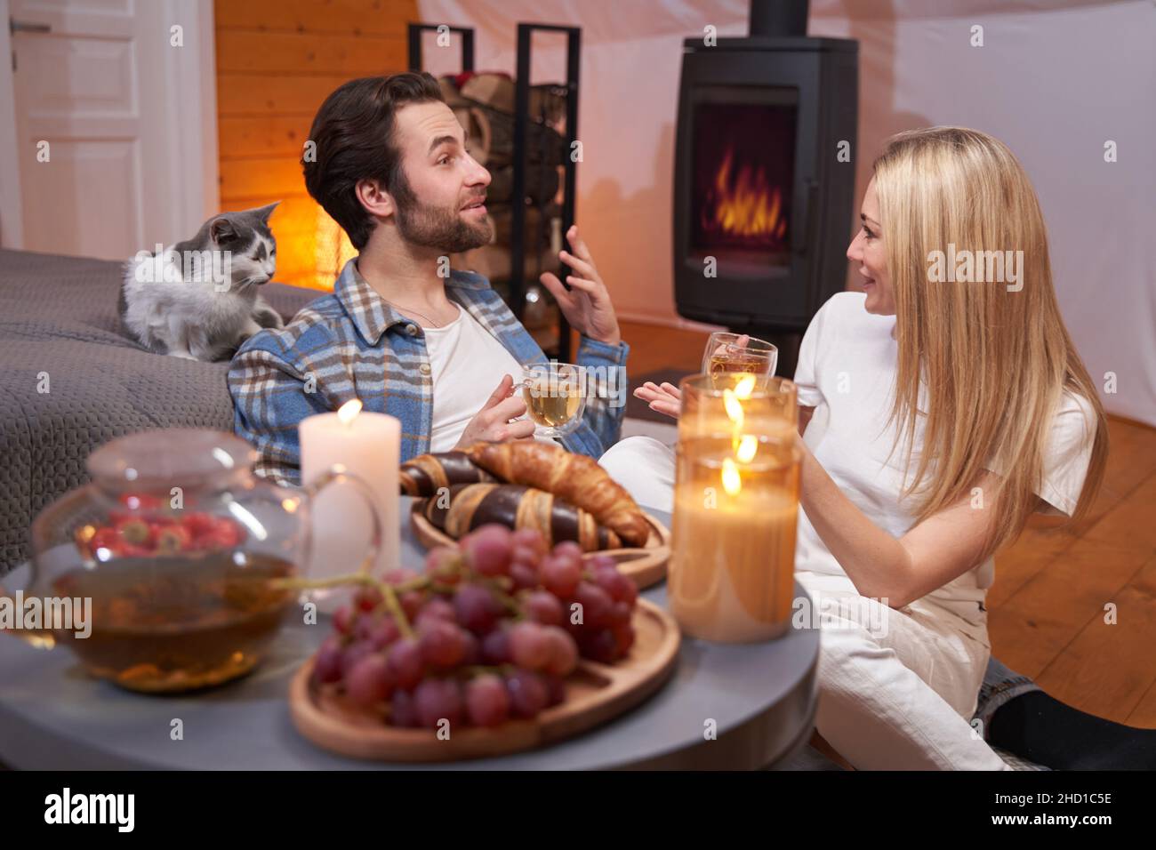 Romantic partners talking and drinking tea at home Stock Photo - Alamy