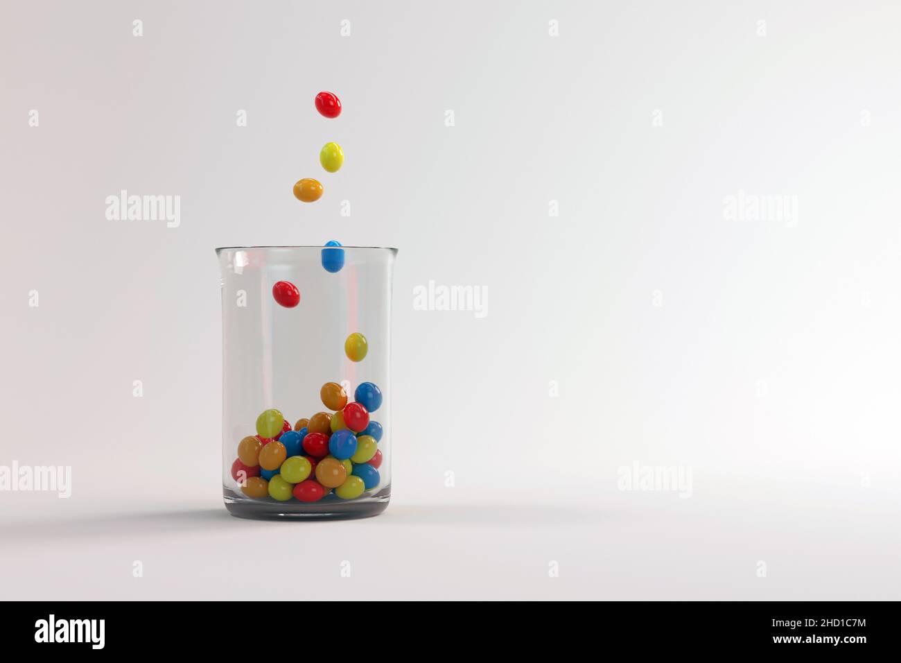 In a transparent glass of colorful sweets Stock Photo - Alamy