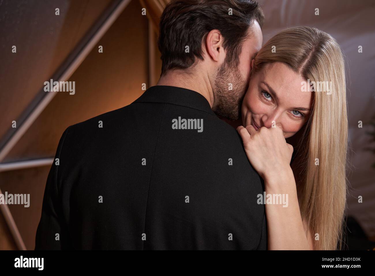 Woman shyly smiling to camera during dance with man Stock Photo - Alamy