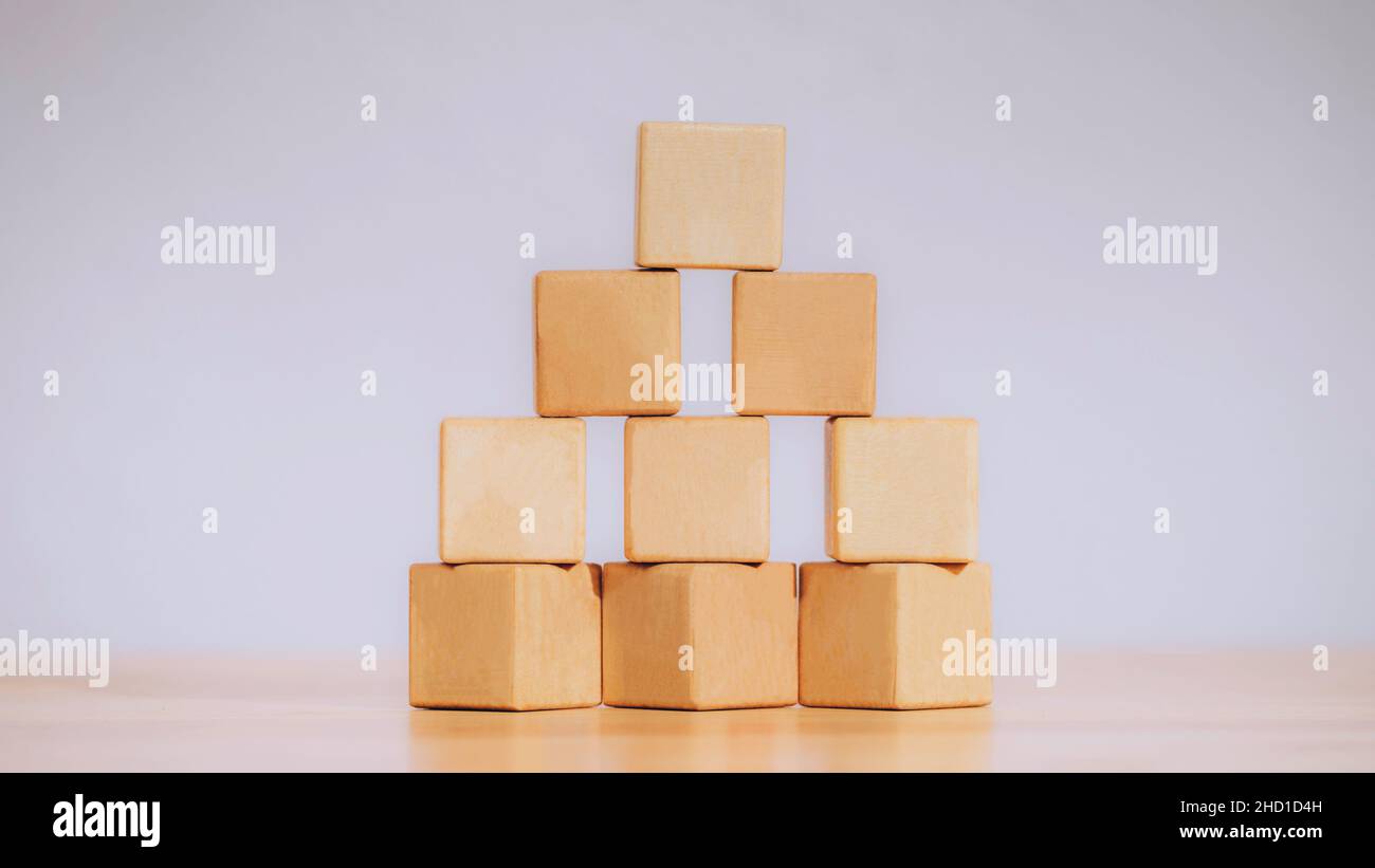 Stacking blank wooden cubes or arrange the wooden blocks on table for input wording and ...