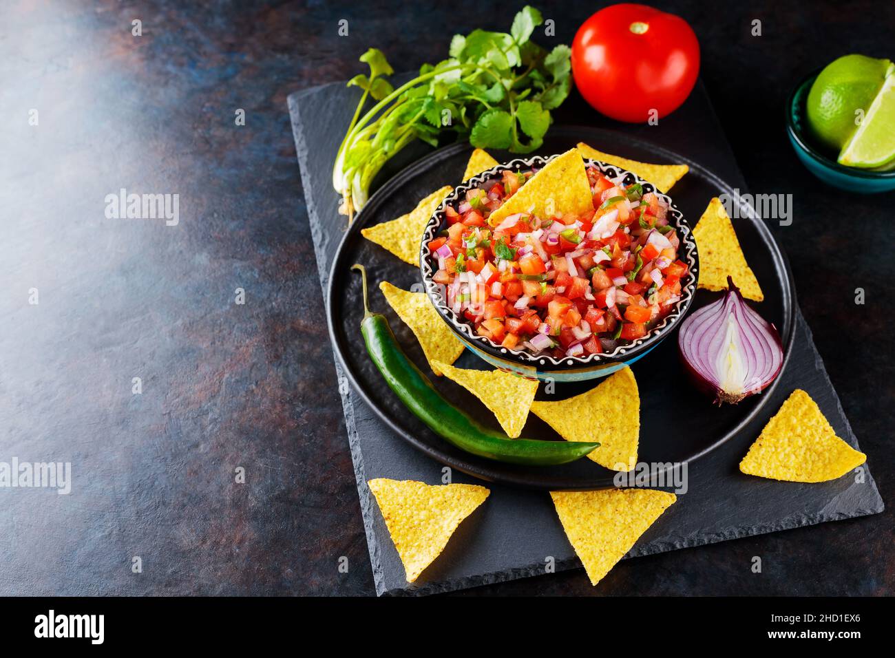 Mexican Pico de Gallo salsa and ingredients. Bowl of tasty Pico de ...