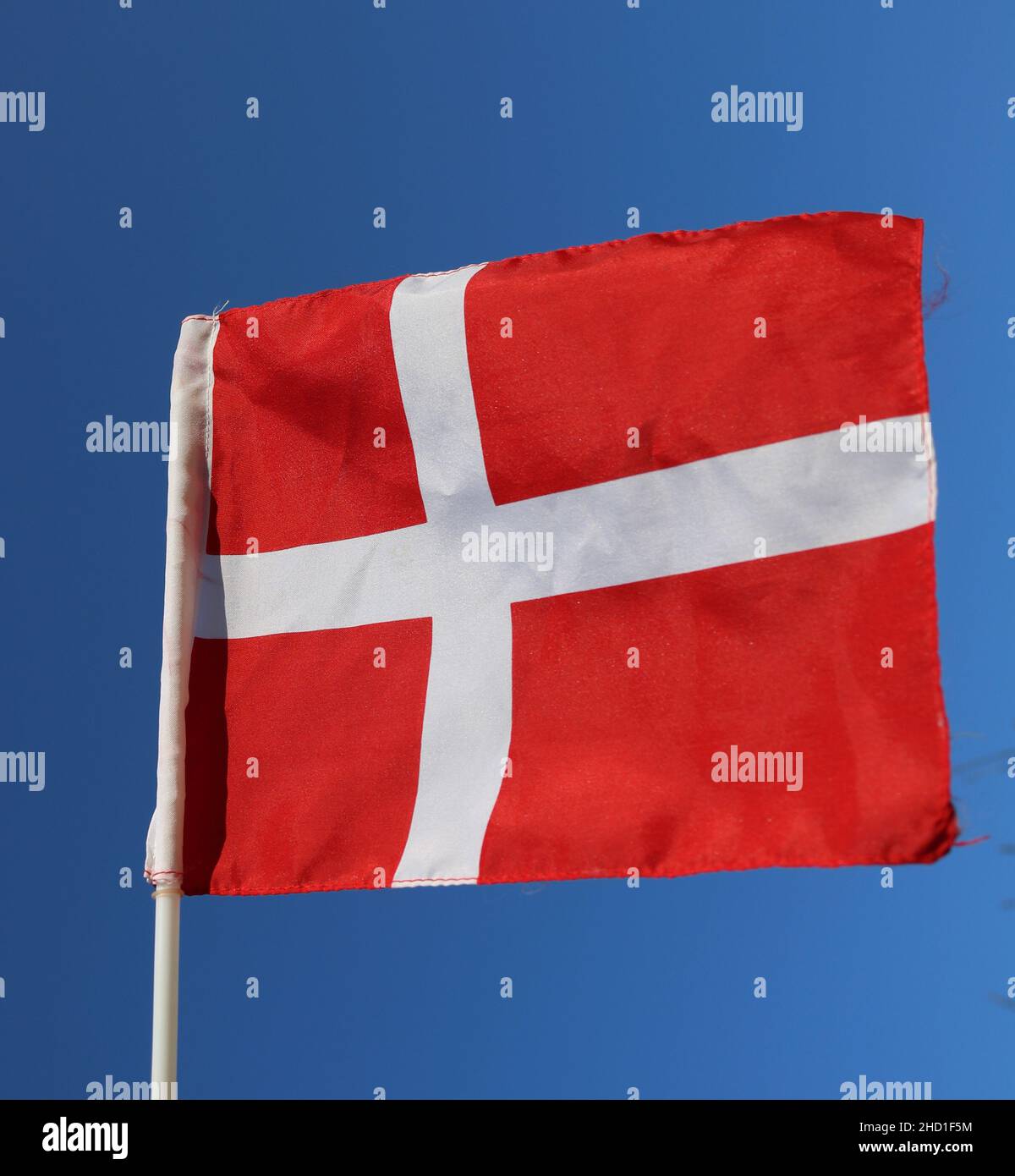 Danish flag flying, Flag of Denmark flying Stock Photo - Alamy