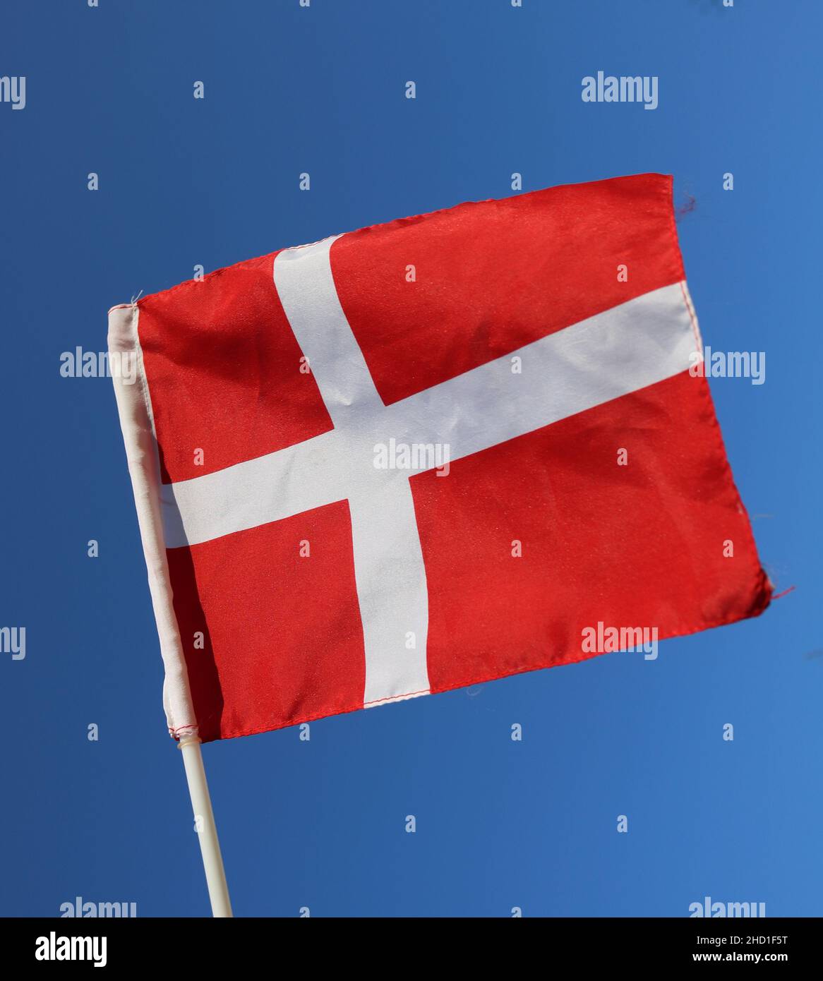 Danish flag flying, Flag of Denmark flying Stock Photo - Alamy