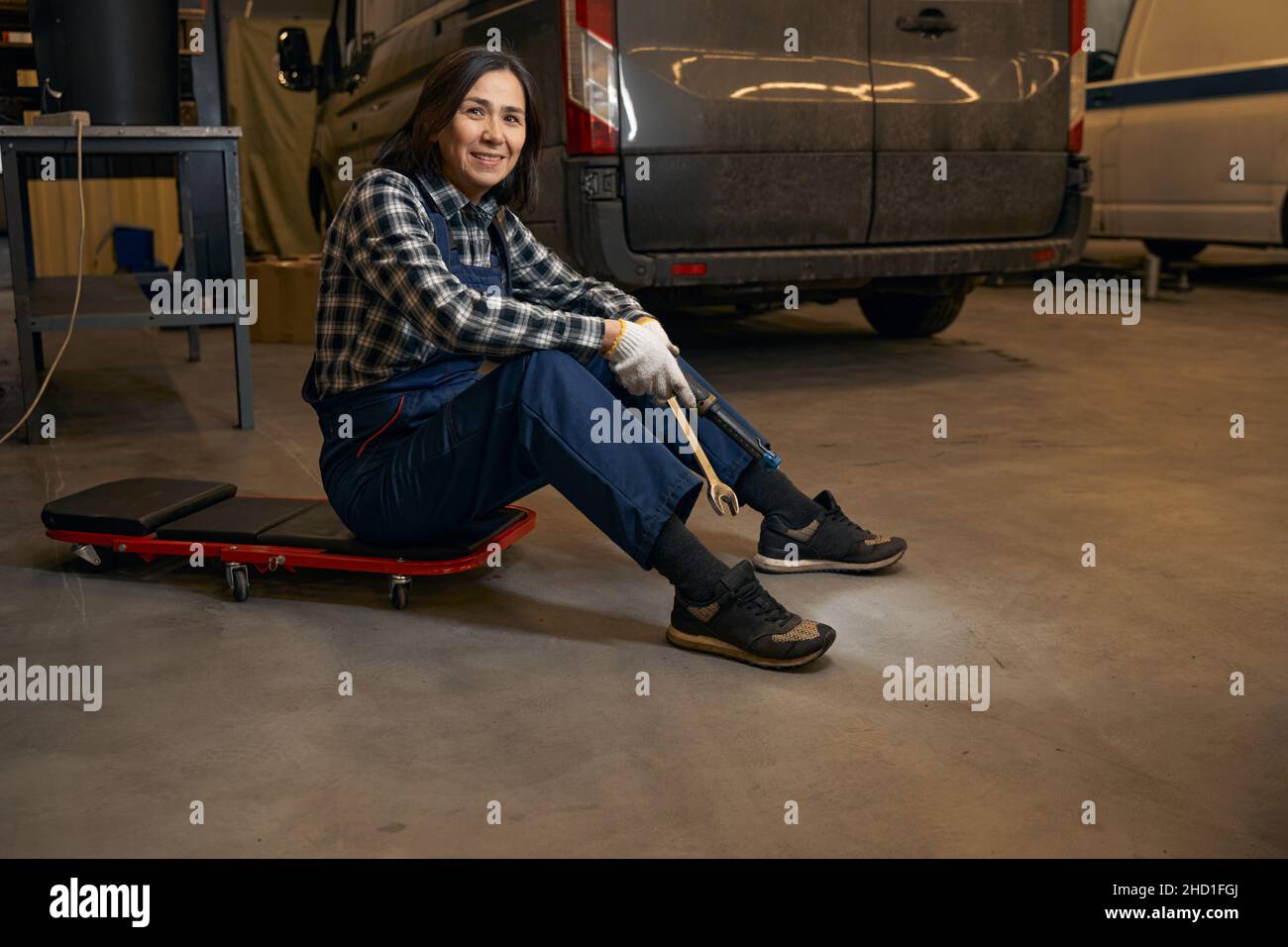Mechanic working hard on car hi-res stock photography and images - Alamy