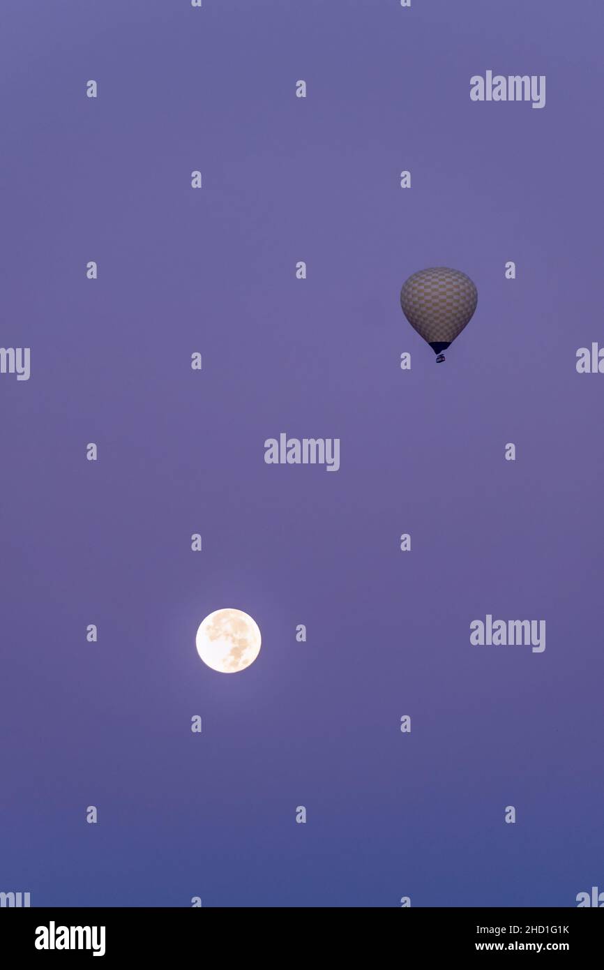 Hot air balloon on full moon night Stock Photo - Alamy