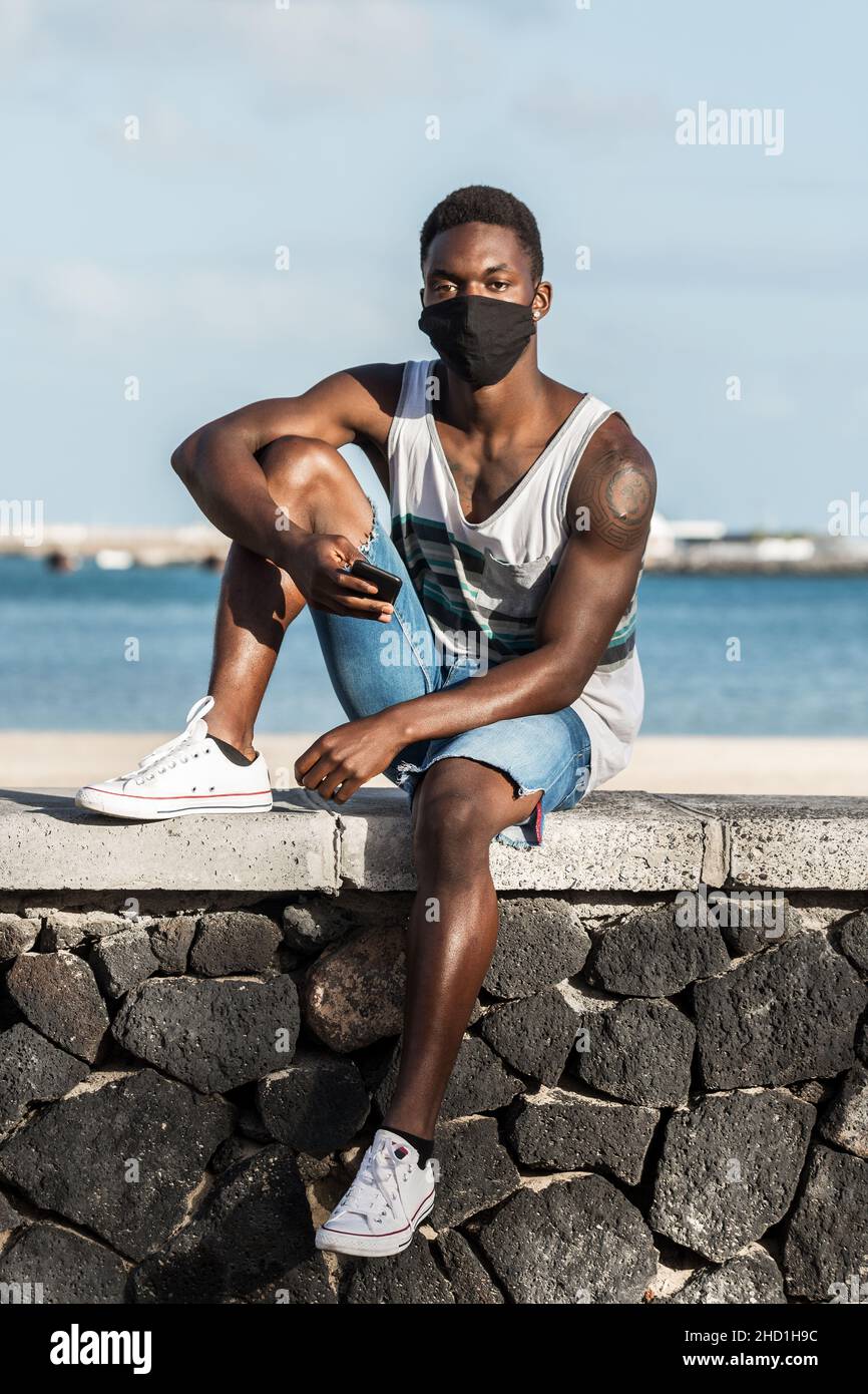 Black guy beach hi-res stock photography and images - Alamy