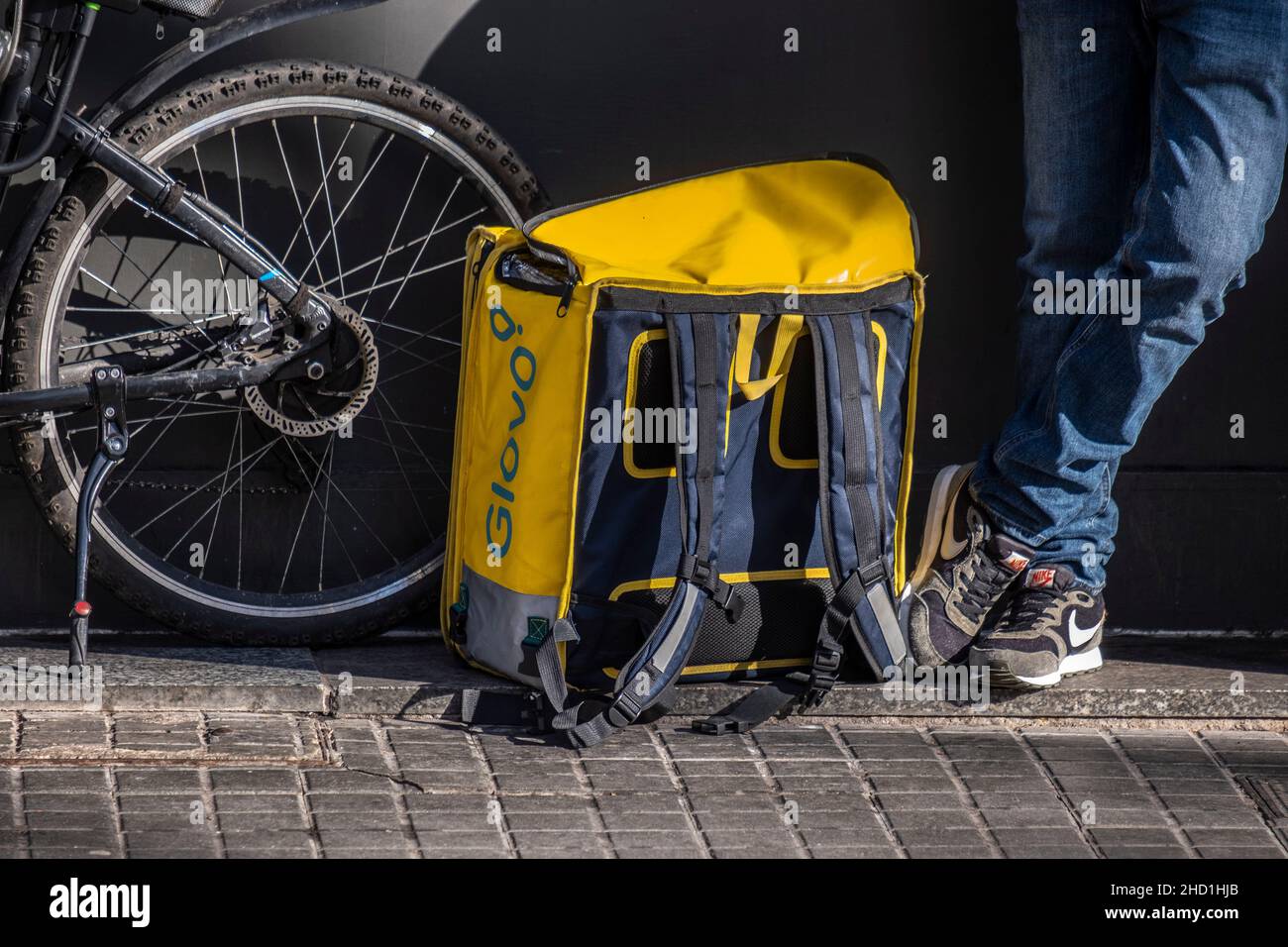 Home delivery man with a bicycle known as "Glovers" from the Spanish ...