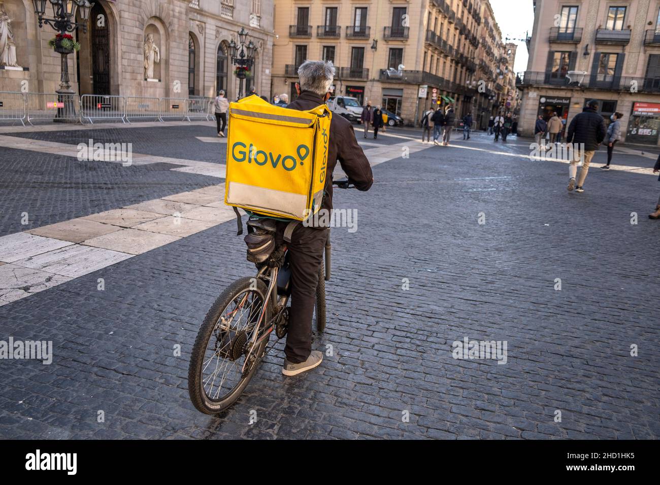 Home delivery man with a bicycle known as "Glovers" from the Spanish ...
