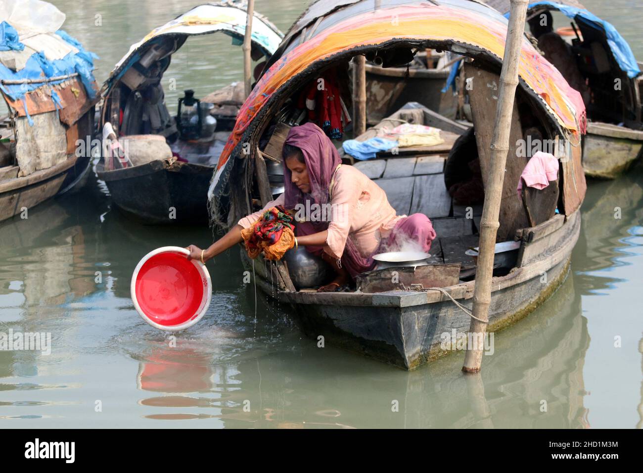 Hundreds of Gypsy families live in small wooden boats on the bank of ...