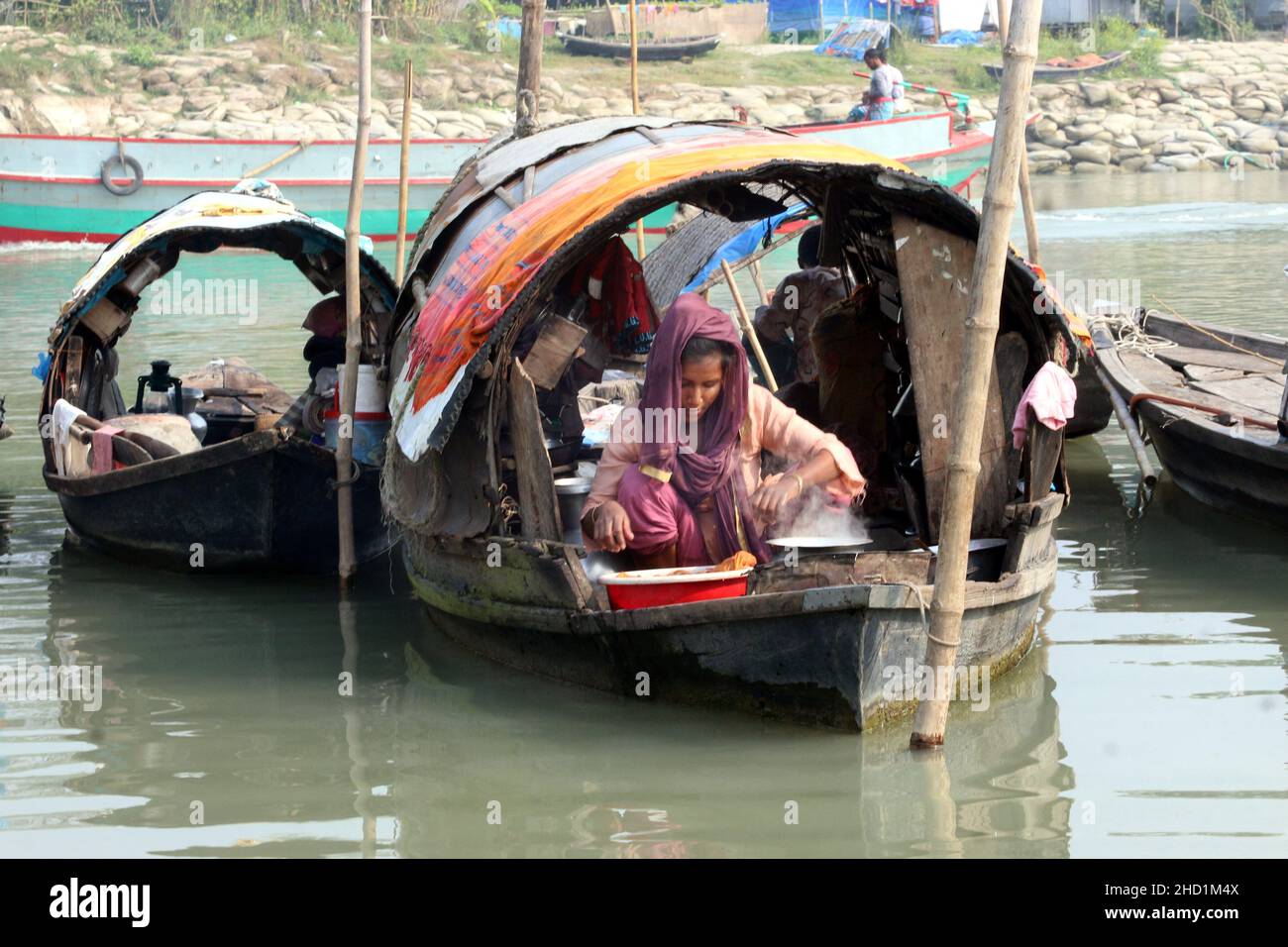 Hundreds of Gypsy families live in small wooden boats on the bank of ...