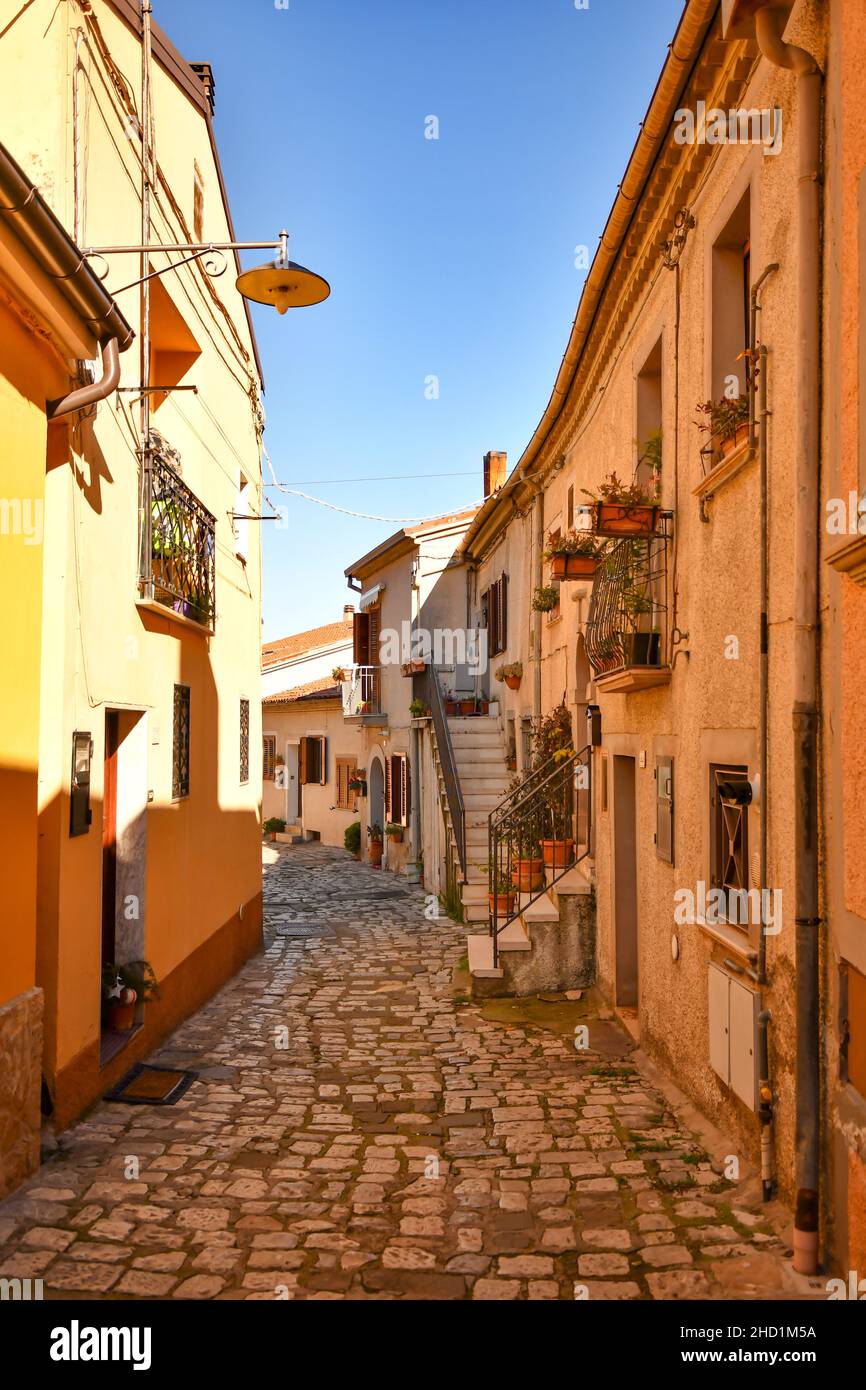 A small street between the old houses of Pignola, a small town in the ...