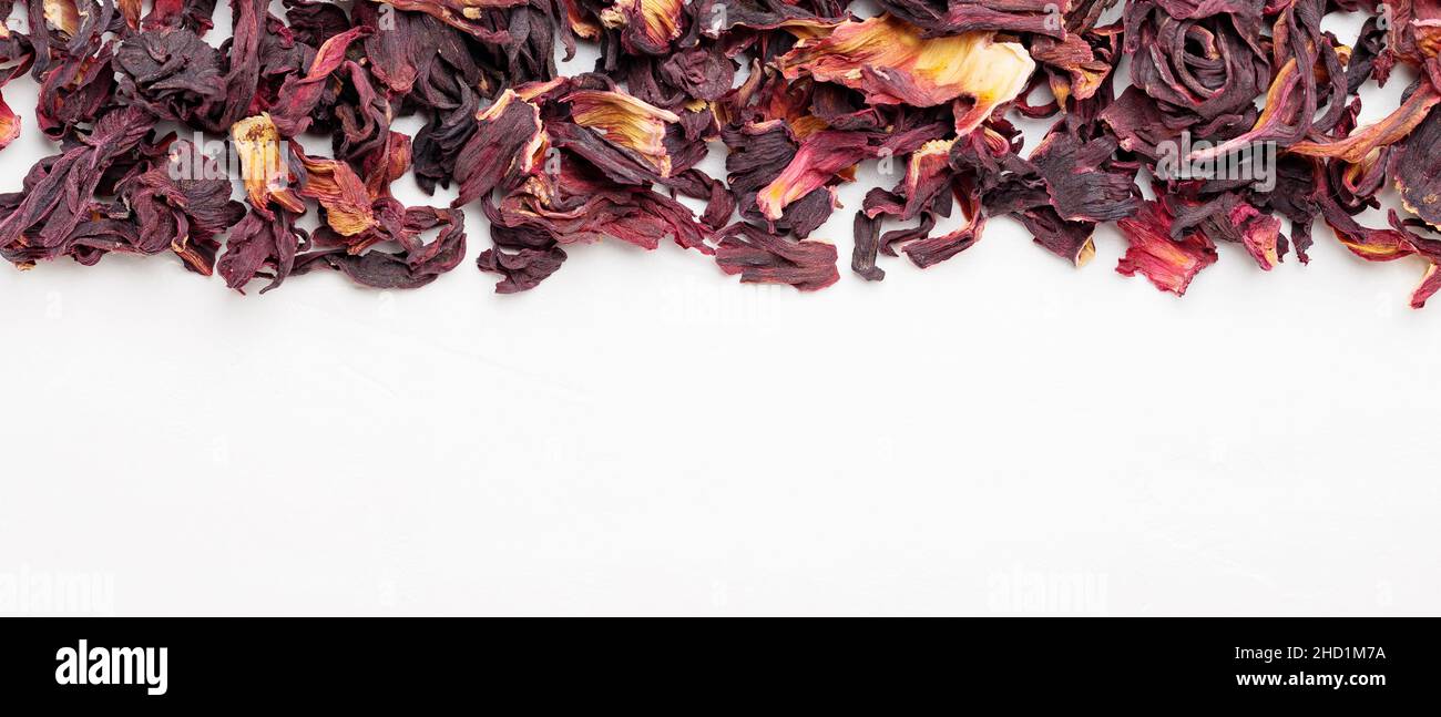 Dried hibiscus calyces on white background. Heap of dried hibiscus ...