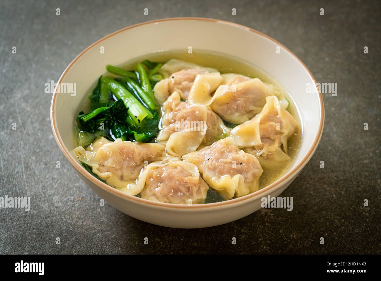 pork wonton soup or pork dumplings soup with vegetable - Asian food ...