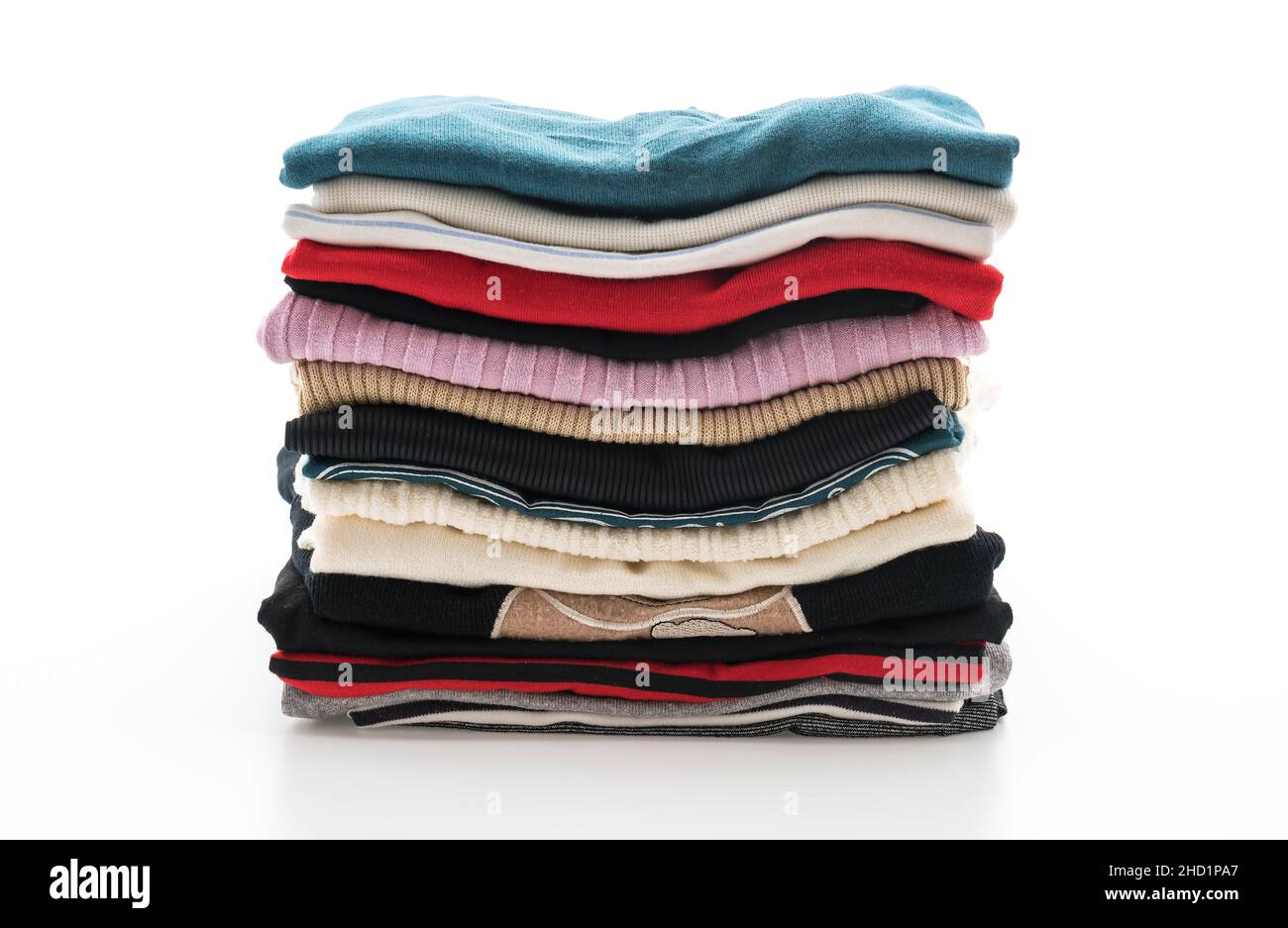 stacks of clothing on white background Stock Photo - Alamy