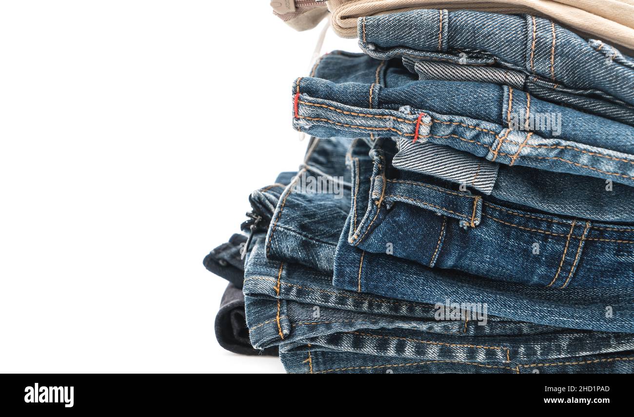 stacks of clothing on white background Stock Photo - Alamy