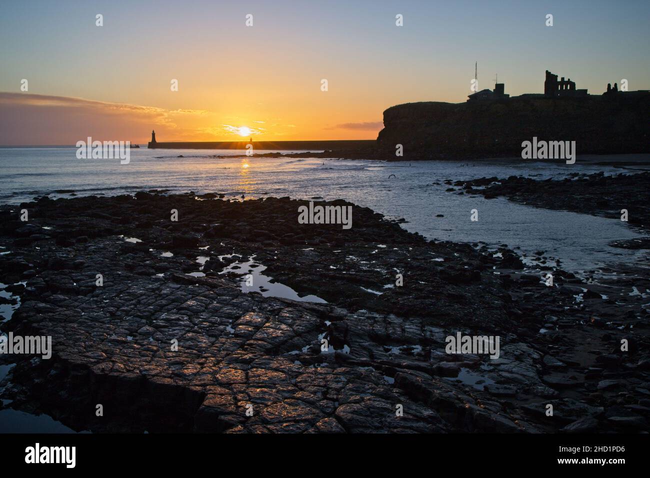 Sunrise at King Edwards Bay, Tynemouth, North Tyneside. The pier and ...