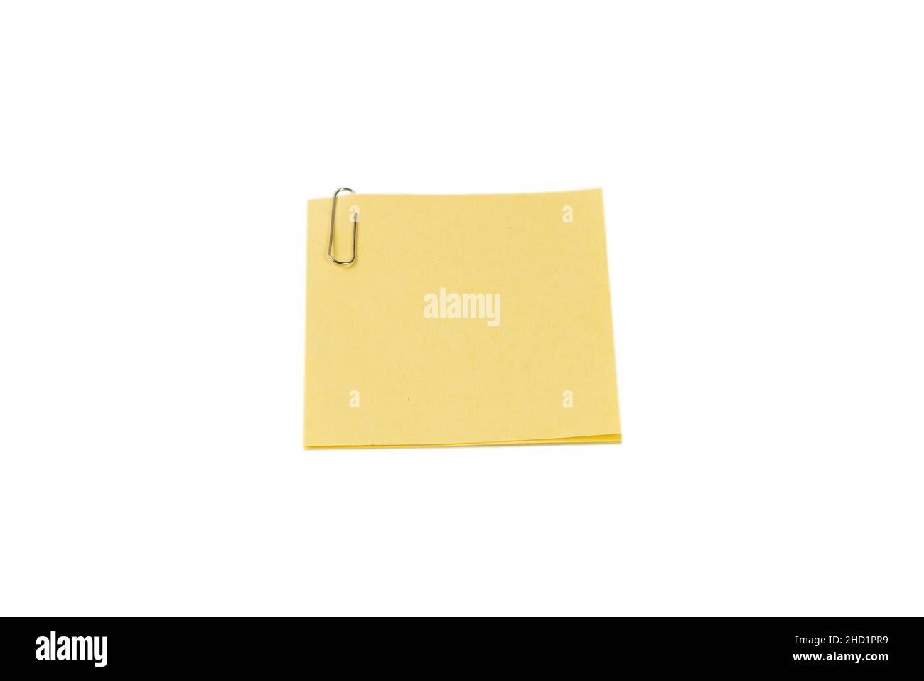 A sticker and a paper clip isolated on a white background. Copy space ...