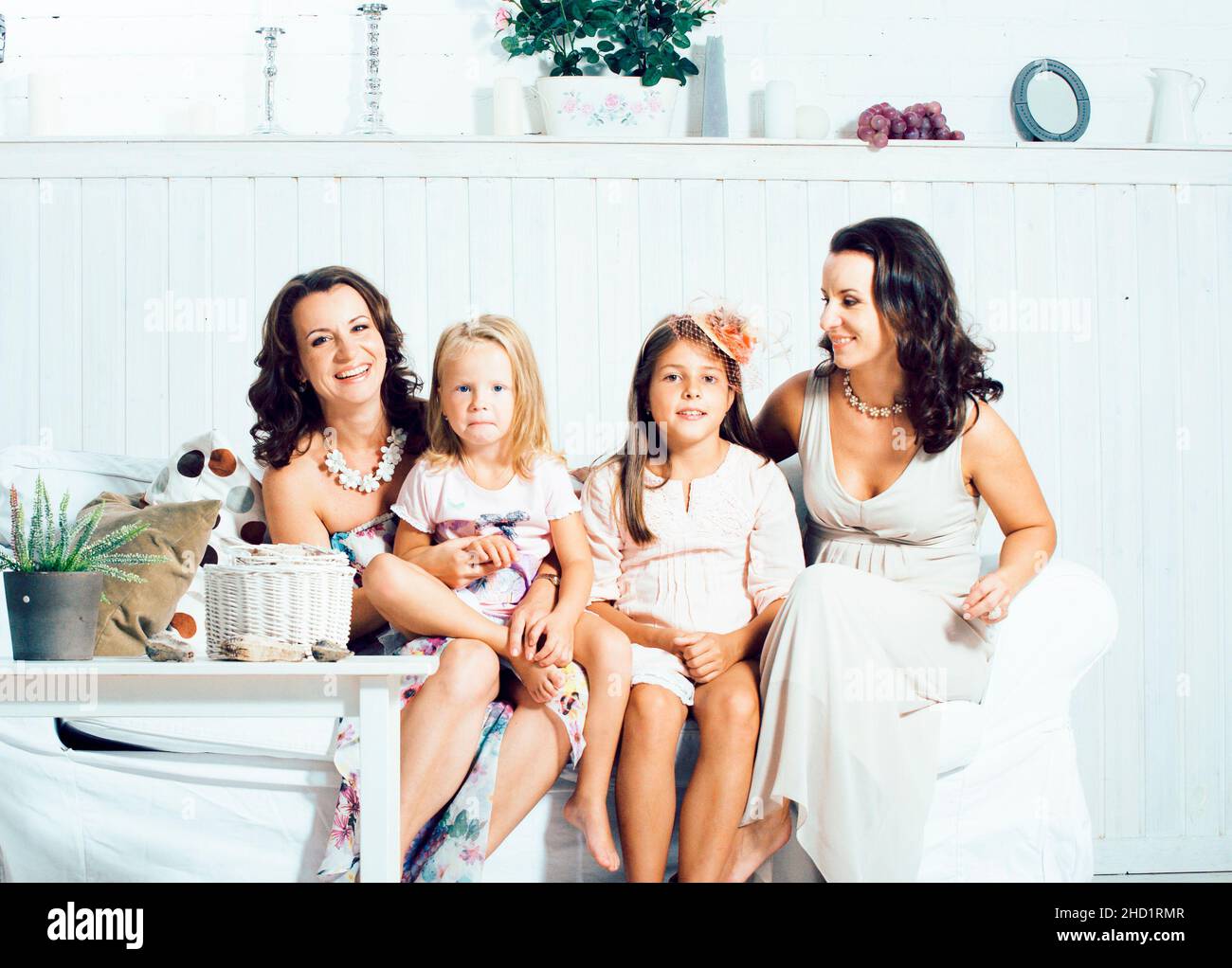 Two pretty brunette twins smiling hi-res stock photography and images ...