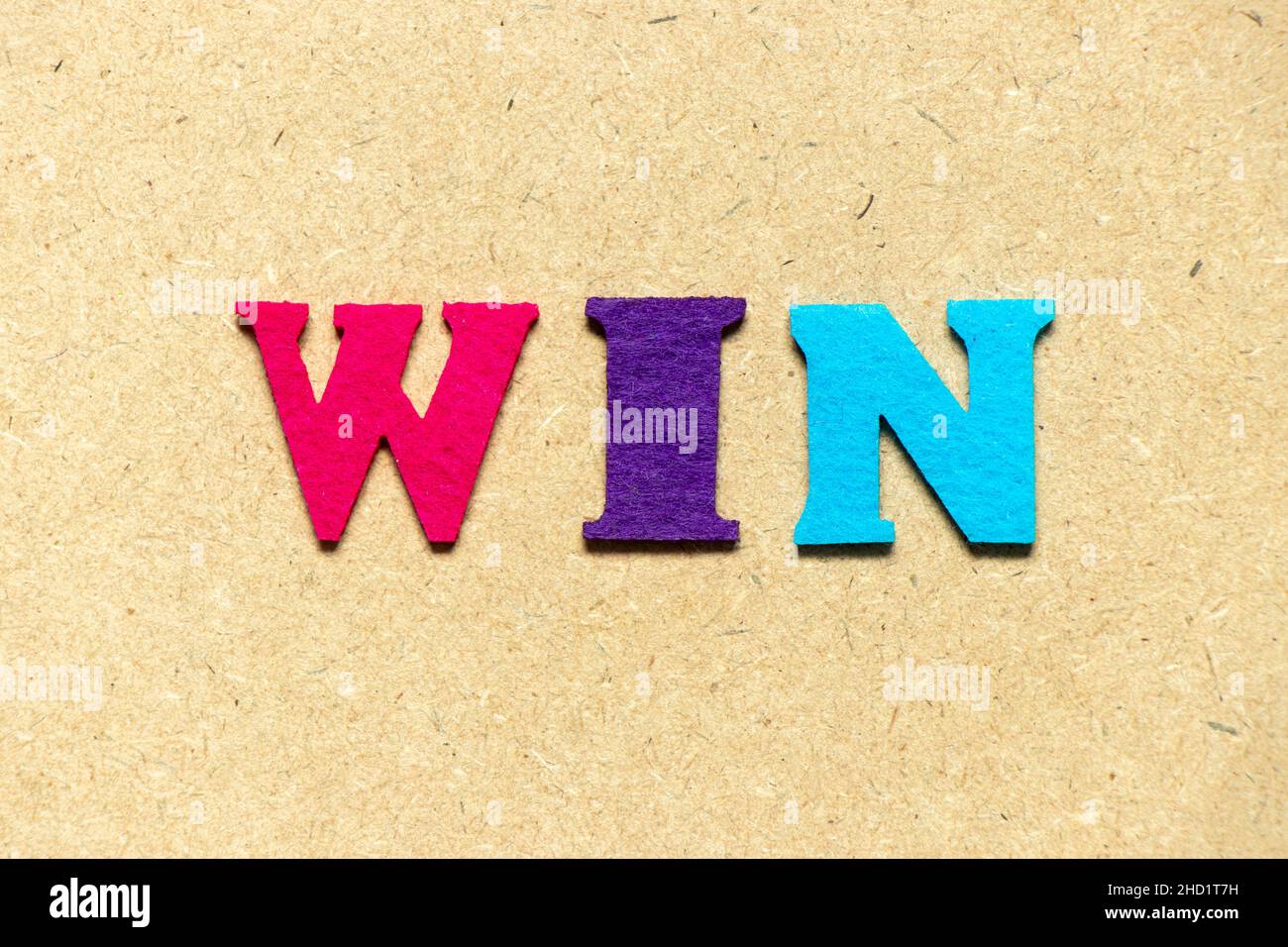 Color cloth alphabet letter in word win on wood background Stock Photo ...