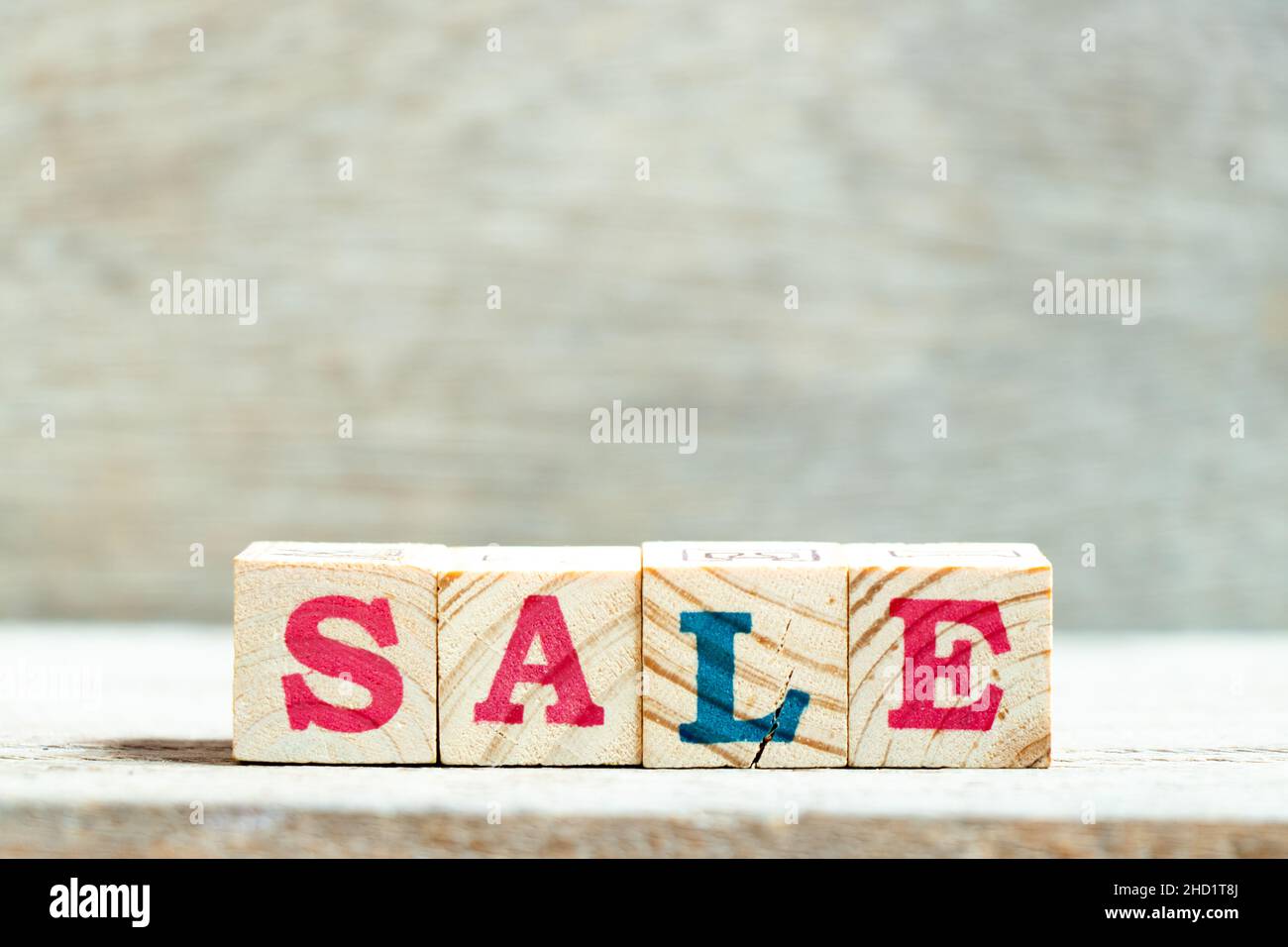 Alphabet letter block in word sale on wood background Stock Photo - Alamy