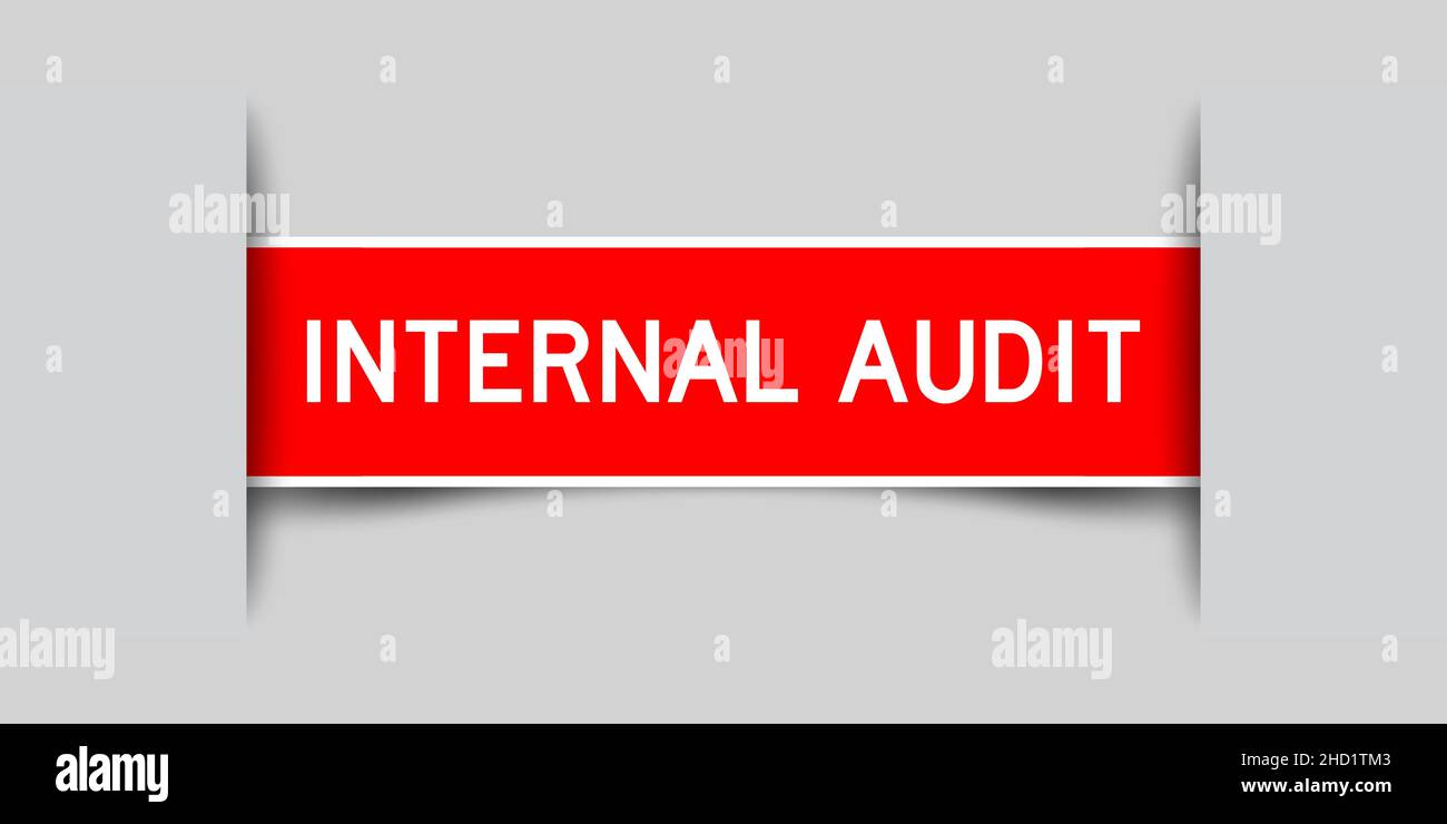 Inserted red color label sticker with word internal audit on gray ...
