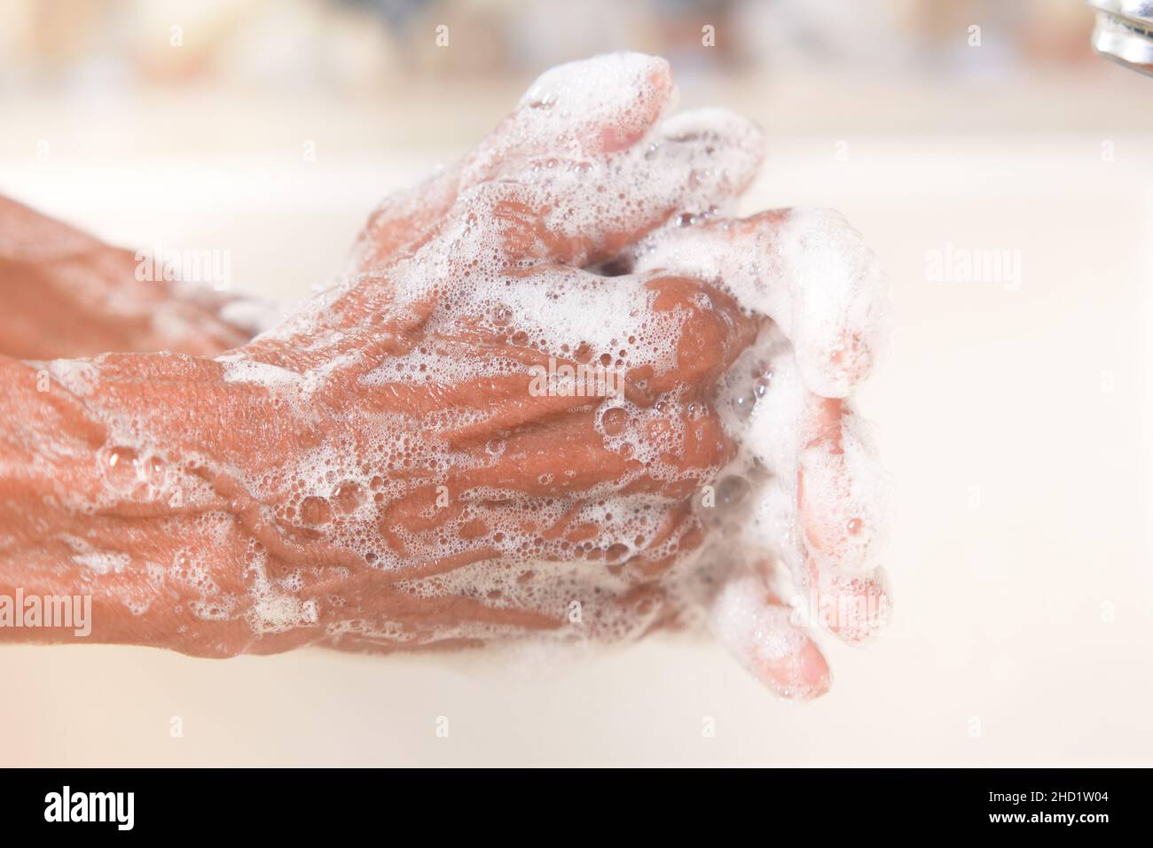 senior women washing hands with soap warm water Stock Photo - Alamy