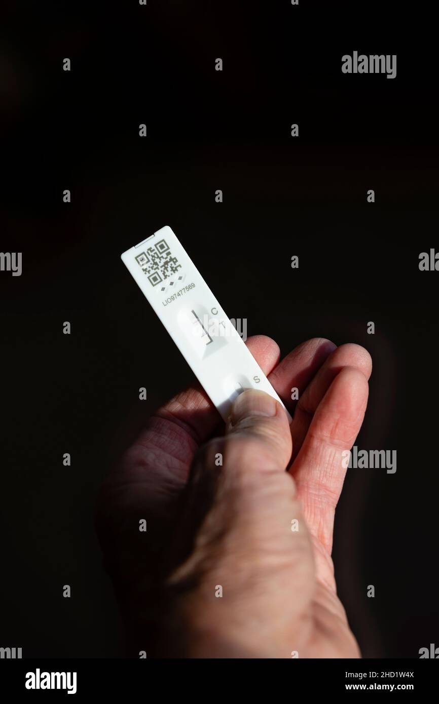 Covid 19 Lateral Flow Test sample showing a positive result in a hand ...