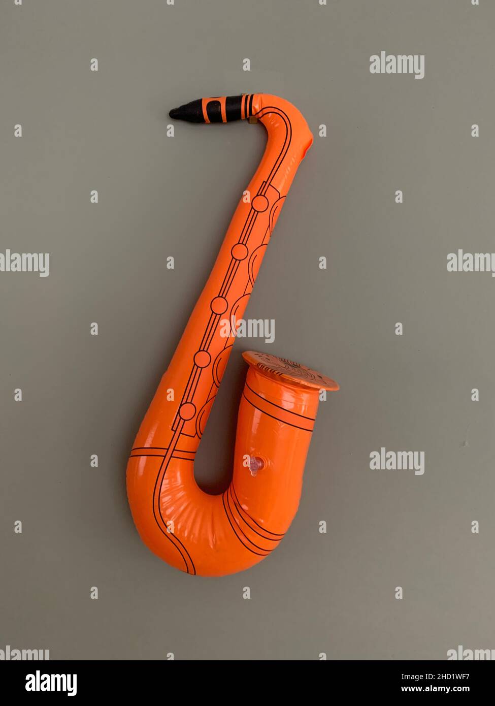 Plastic orange Saxophone Stock Photo - Alamy