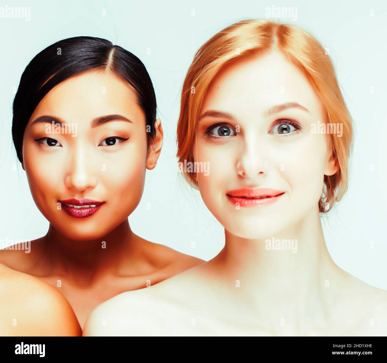 different nation woman: caucasian and asian together isolated on white ...