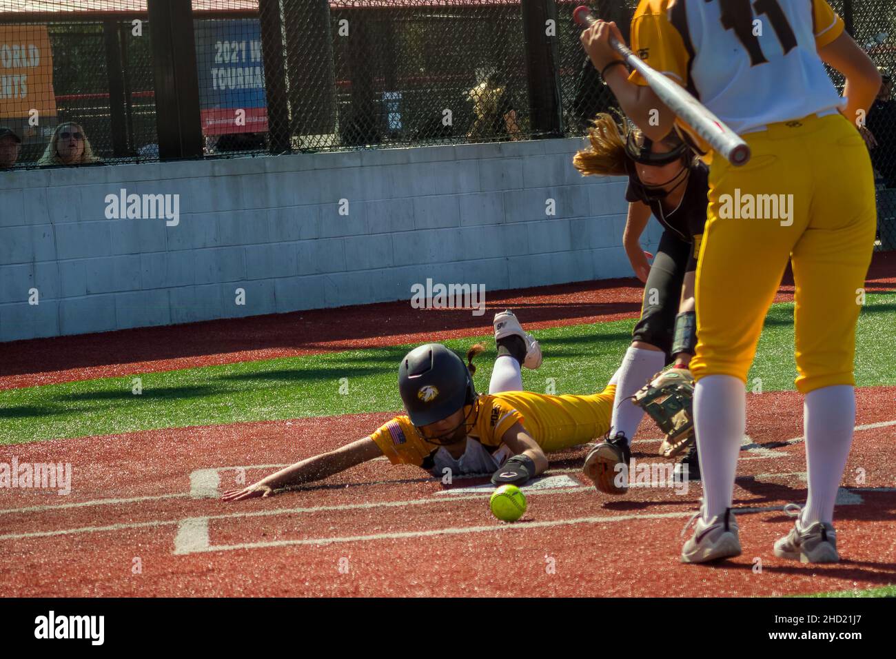 Closeup shot of females playing softball in the field in Mason in the ...