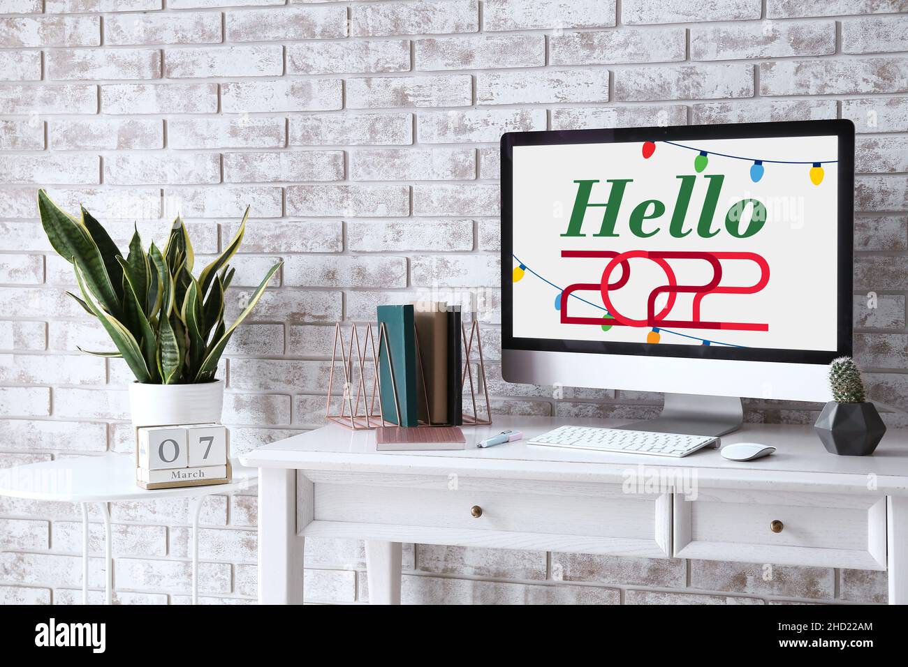 Text HELLO 2022 on screen of computer monitor at workplace in office ...