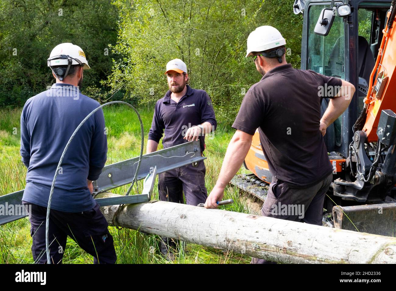 Western Power workers engineers erecting a new utility pole line to ...