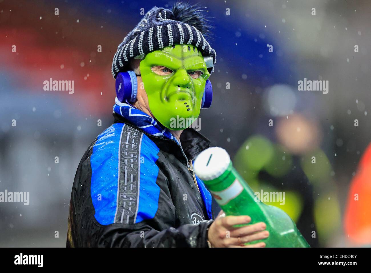 Football fan masked up for the game Stock Photo - Alamy