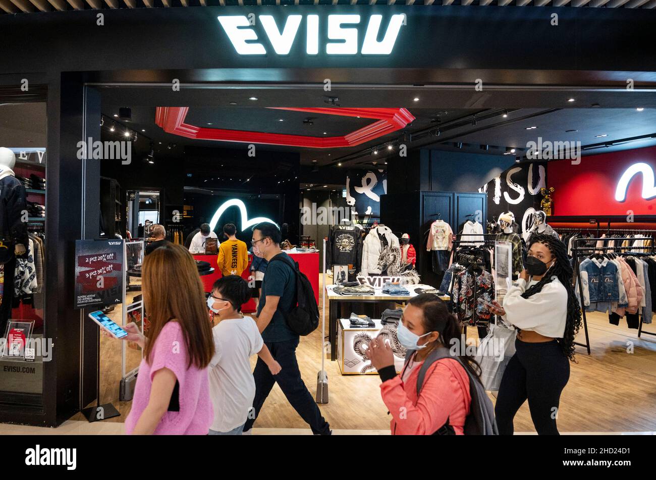 Hong Kong, China. 21st Nov, 2021. Shoppers walk past the Japanese ...