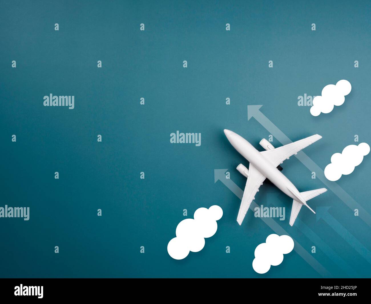 White clouds and heading arrows moving beside the white plane model on ...