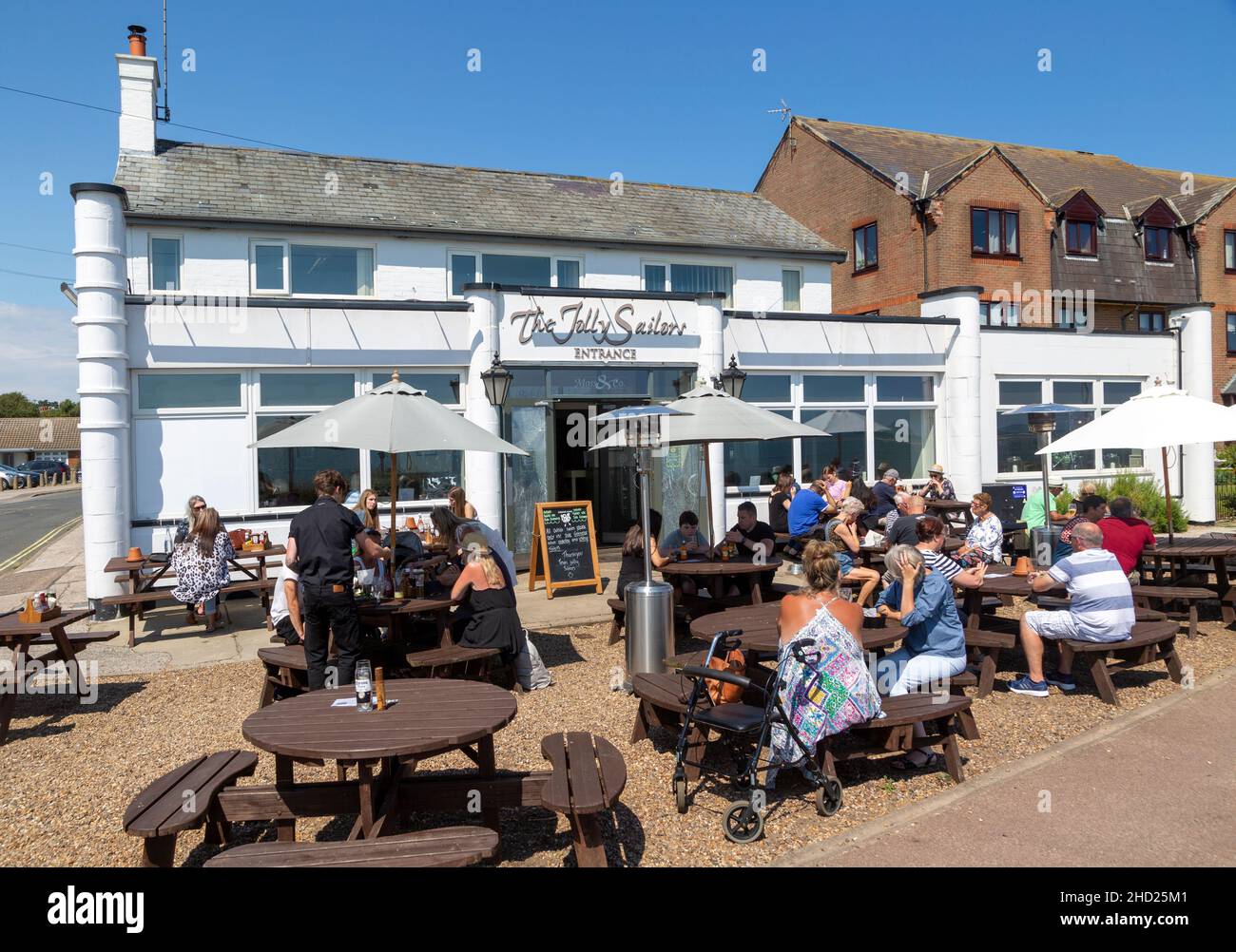 People sitting in sunshine outside the Jolly Sailors pub, Pakefield ...