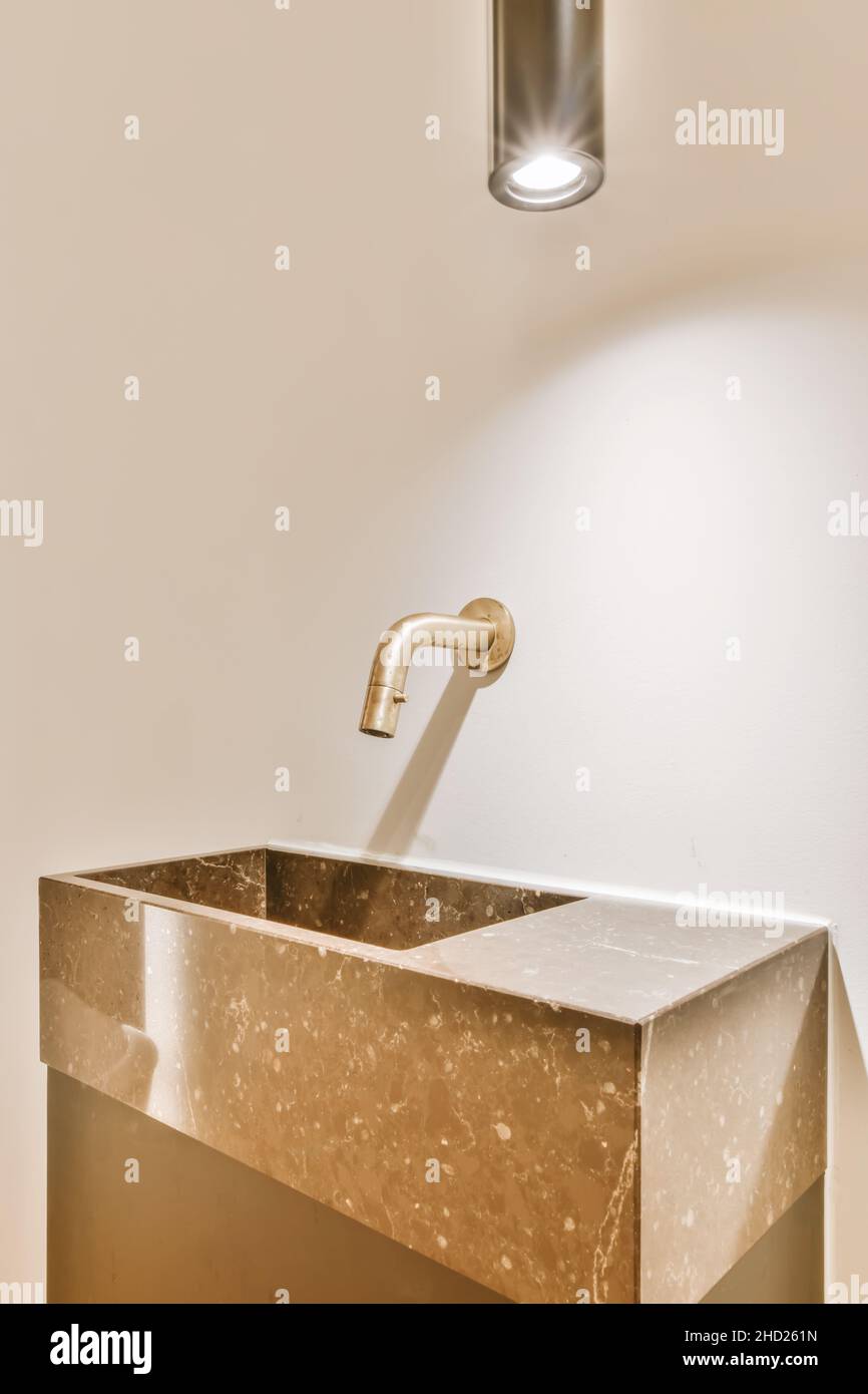Small marble sink with built-in wall tap Stock Photo - Alamy