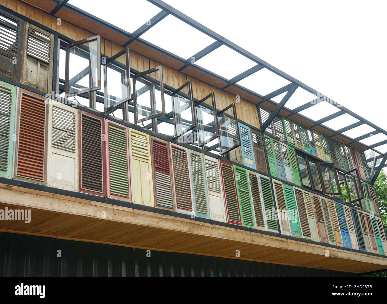The design of old windows in various colors decorates a house Stock ...