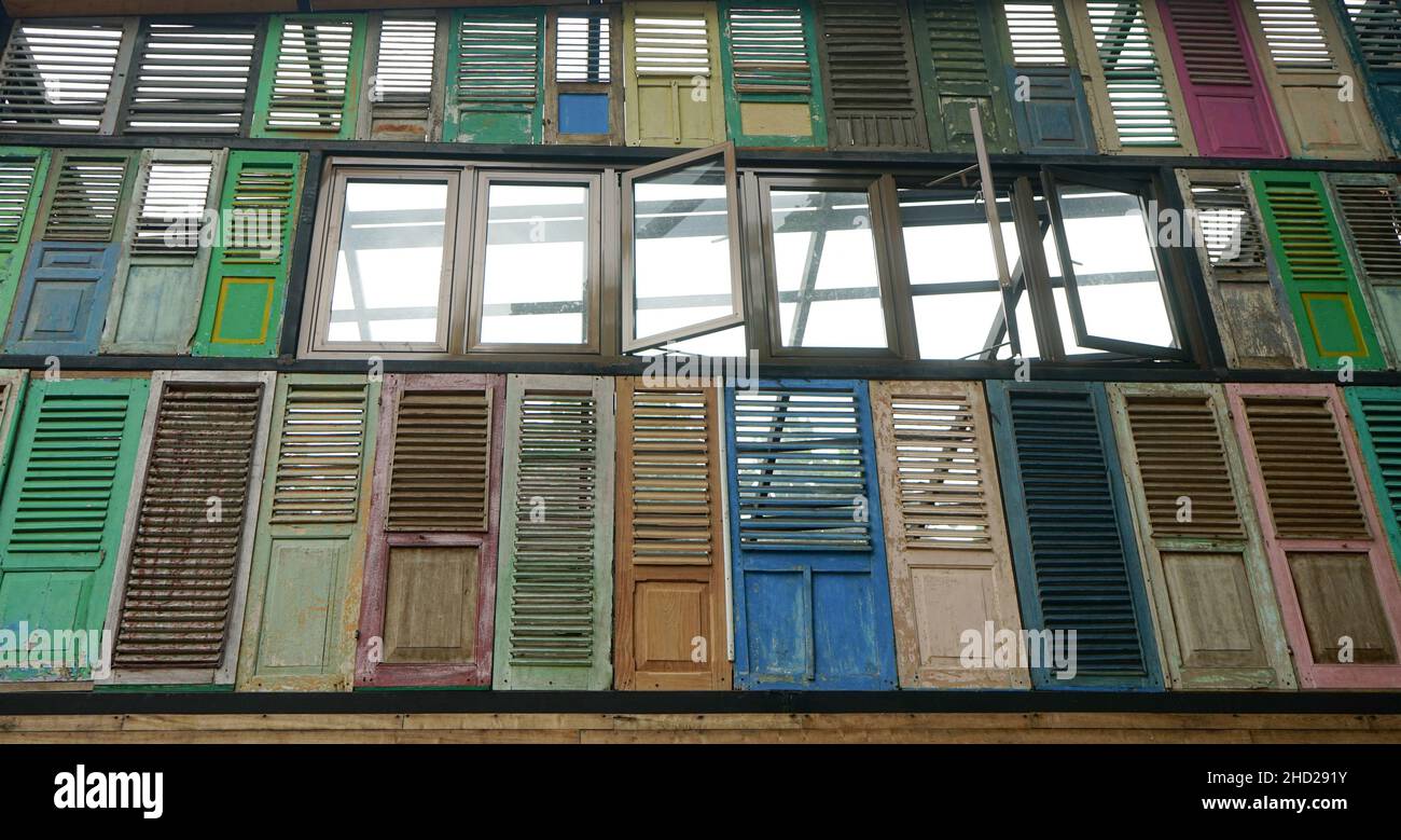 The design of old windows in various colors decorates a house Stock ...
