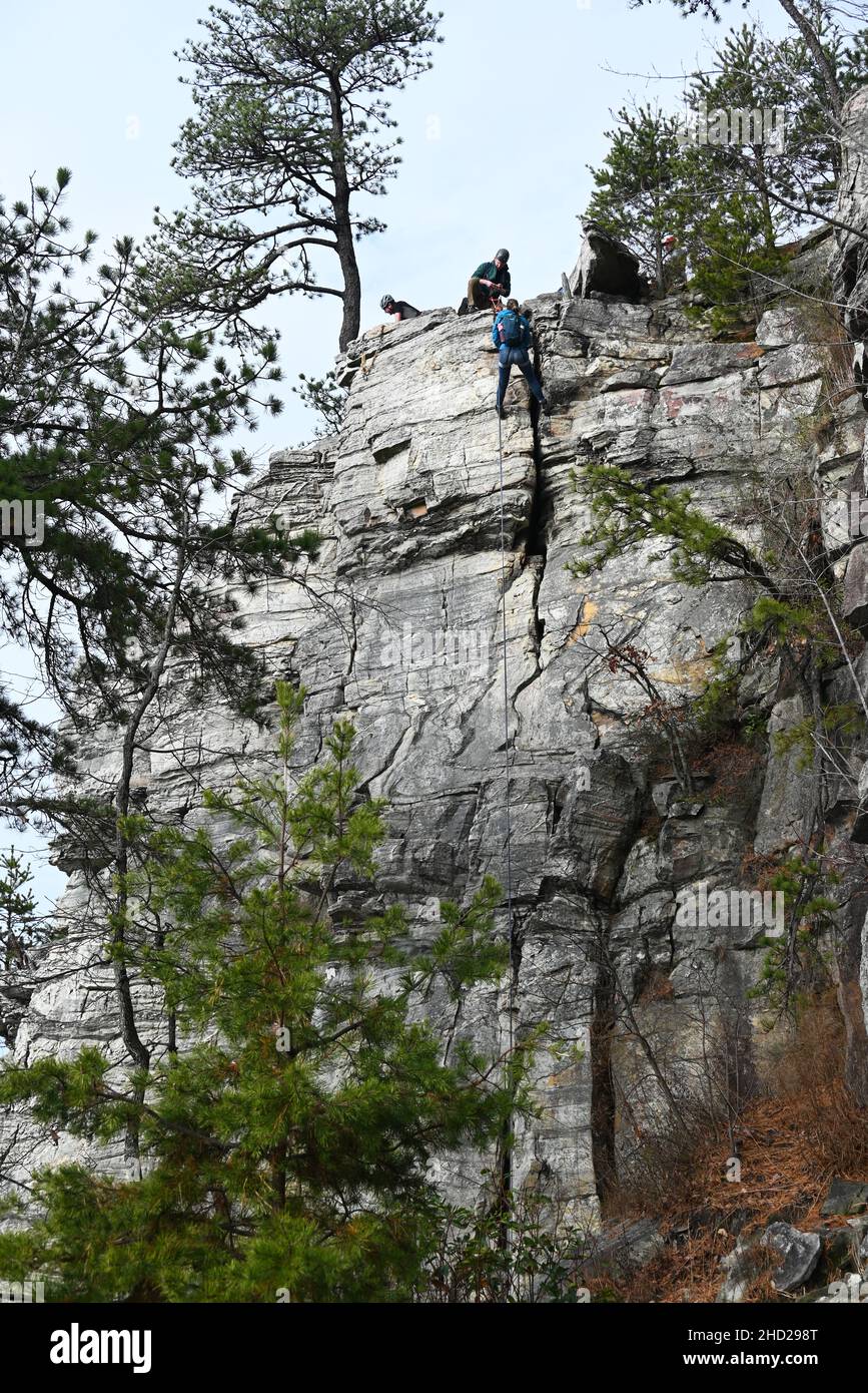 A couple rappels down a cliff face on the Ledge Spring Trail at Pilot ...